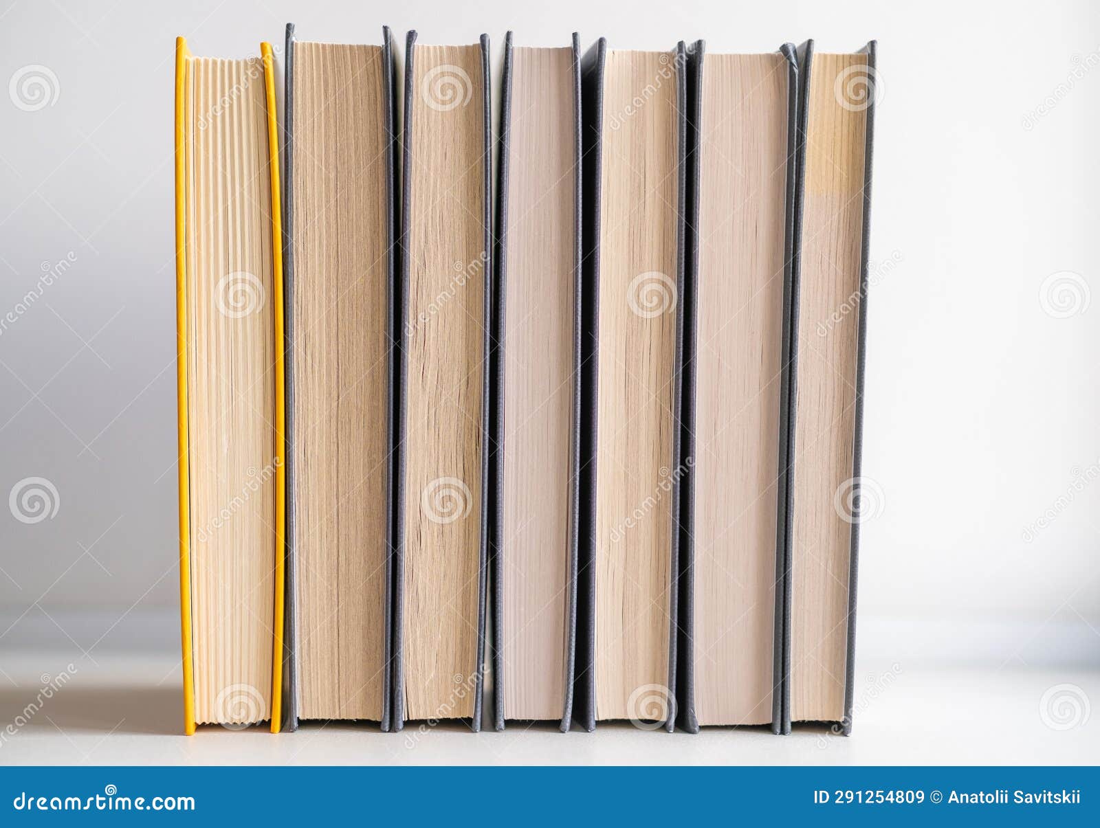 Stack of Books on a White Background. One Book is Yellow Stock Image ...