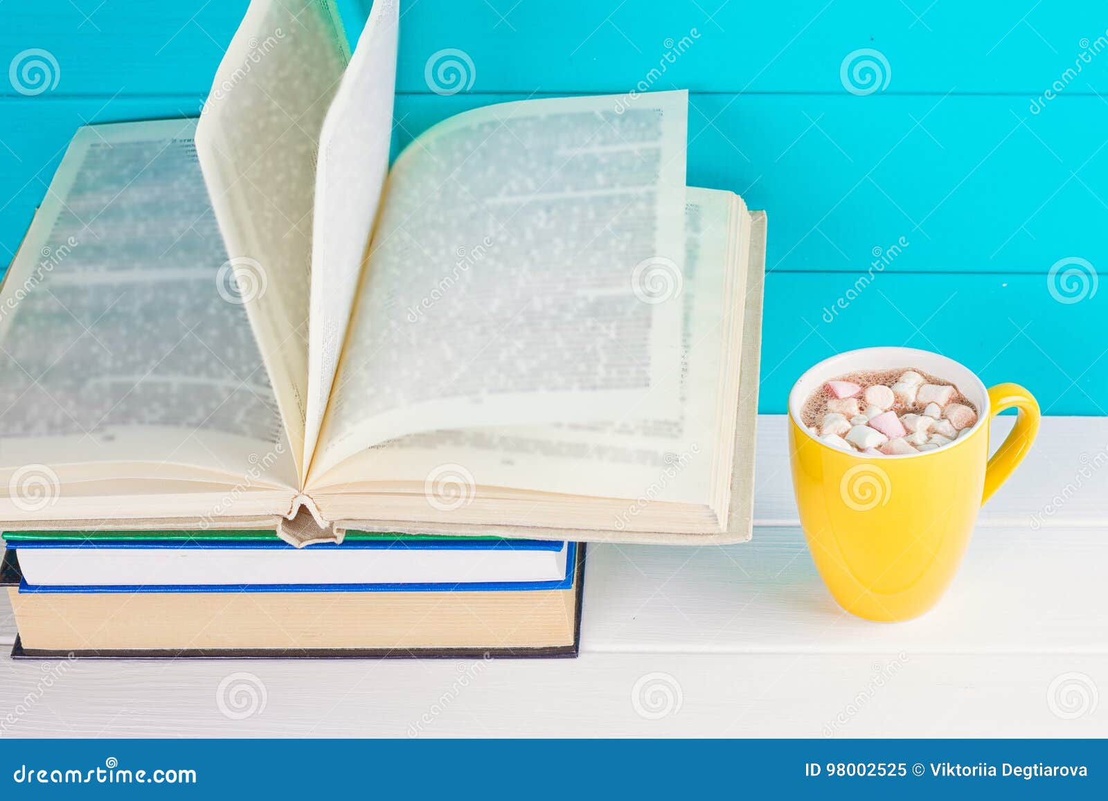 Stack of Books on Wooden Table with a Cup of Tea Stock Image - Image of ...