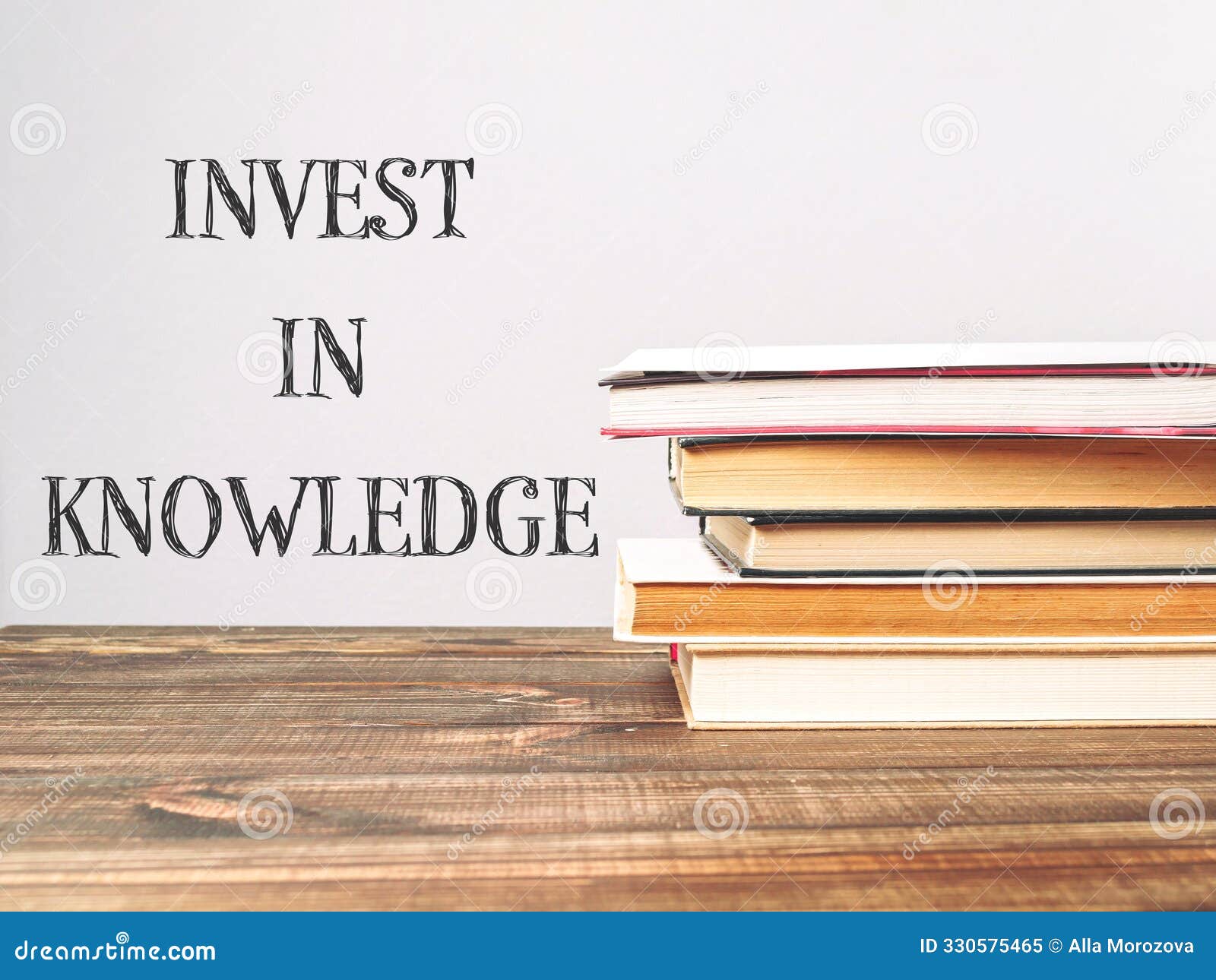 A Stack of Books with the Words Invest in Knowledge Written on Top ...
