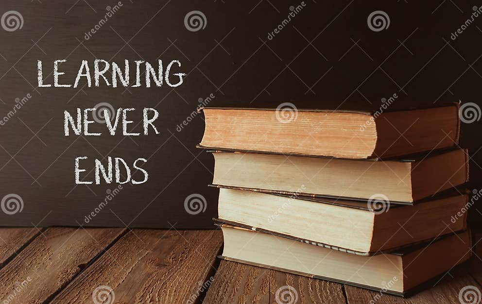 A Stack of Books with the Words Learning Never Ends Written on a Chalkboard Stock Image - Image ...