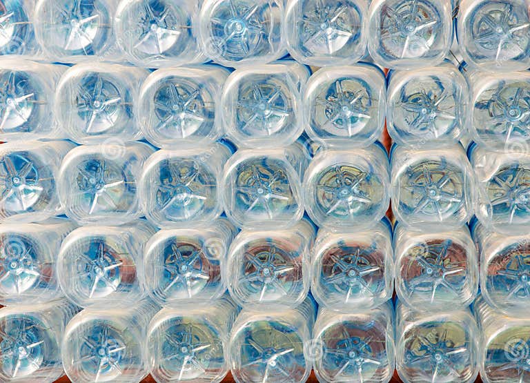 Stack of Bottom of Plastic Bottles Stock Image - Image of light, jugs ...