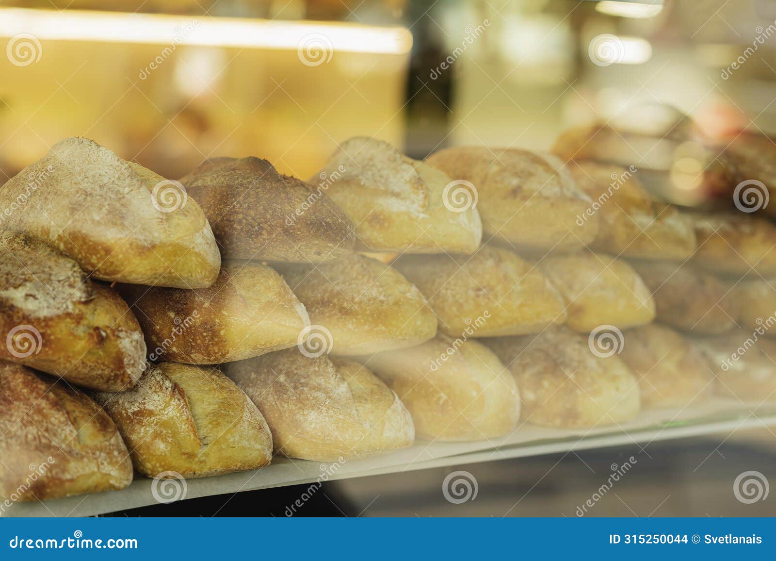 Stack of Bread Loaves are Displayed in Bakery Shop Window Stock Photo ...