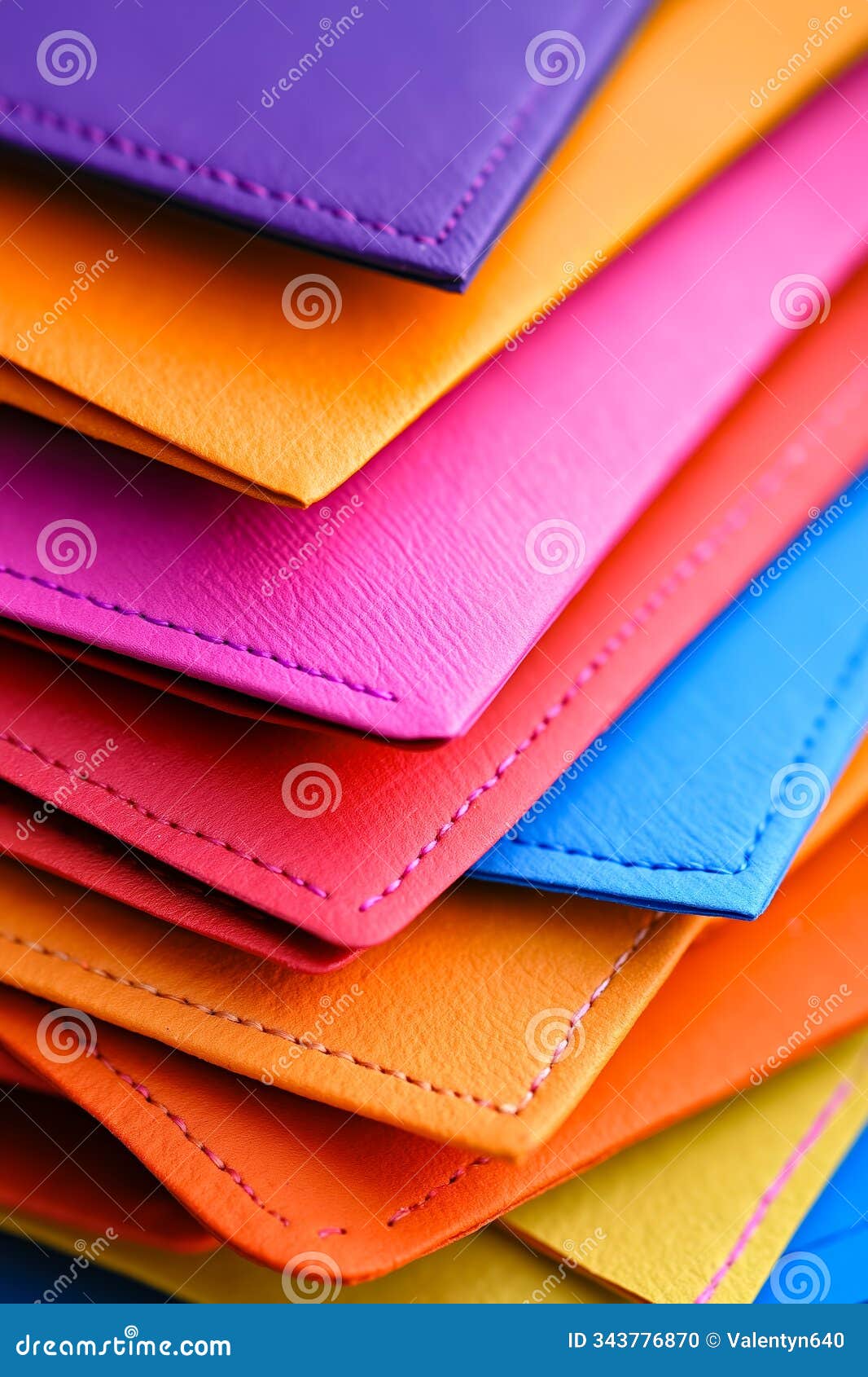 A Stack of Brightly Colored Leather Wallets Stacked on Top of Each ...