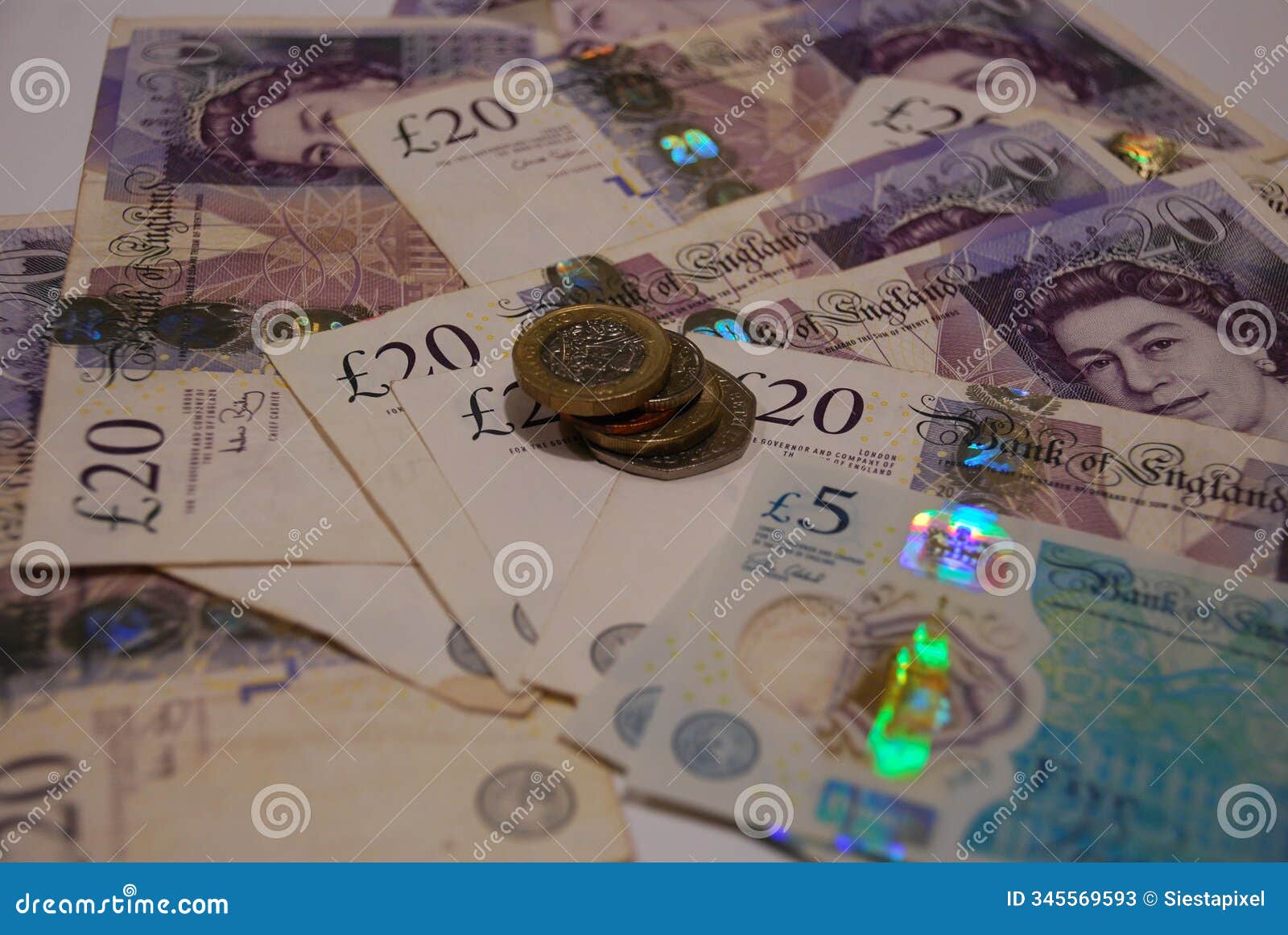 Stack of British Pound Notes and Coins on a Table Stock Image - Image ...