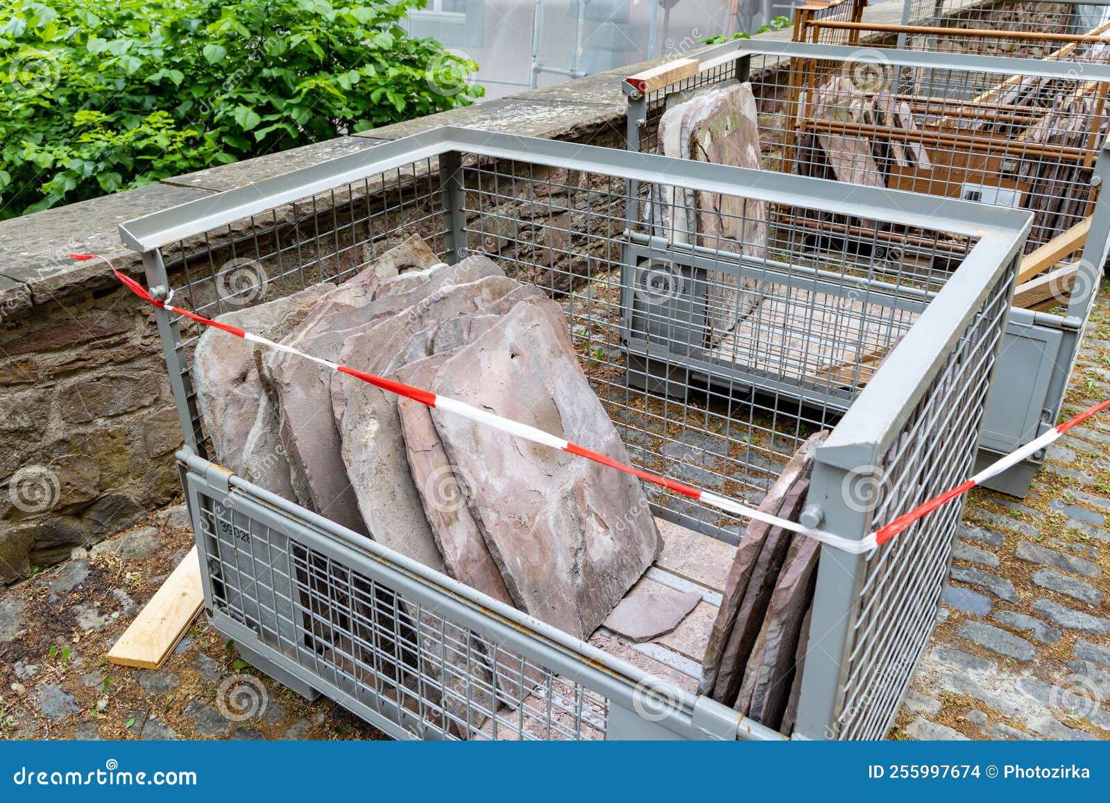 A Stack of Brown Slate Stones Inside a Container at a Construction Site ...