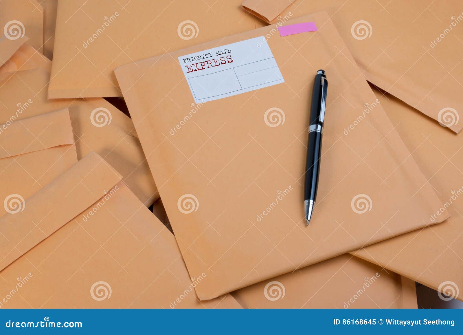 Stack of Bubble Wrap Padded Mailing Envelopes and Pen on White B Stock ...