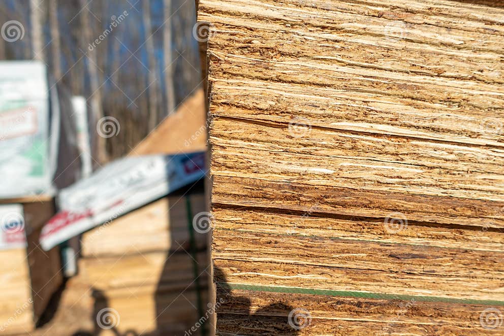 Stack of Building Lumber at Construction Site Stock Image - Image of ...