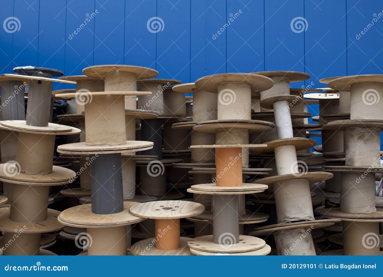 Stack of cable drums stock image. Image of production - 20129101