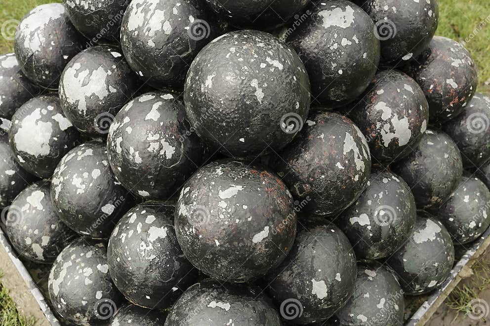 A stack of cannonballs stock photo. Image of large, cannonballs - 277298094