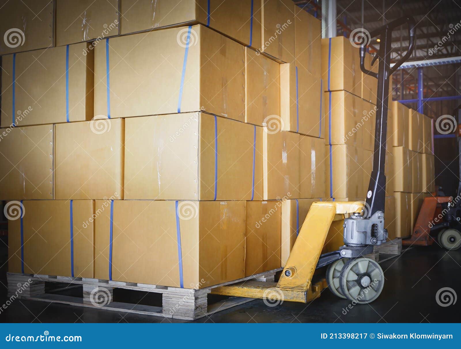 Stack of Card Board Boxes with Hand Pallet Truck. Interior of Storage ...