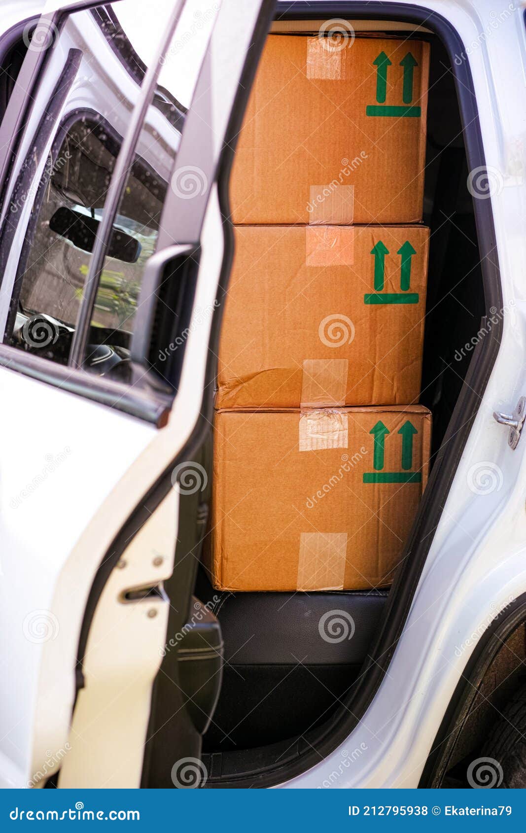 Stack of Cardboard Boxes on Back Seat of White Car Stock Photo - Image ...
