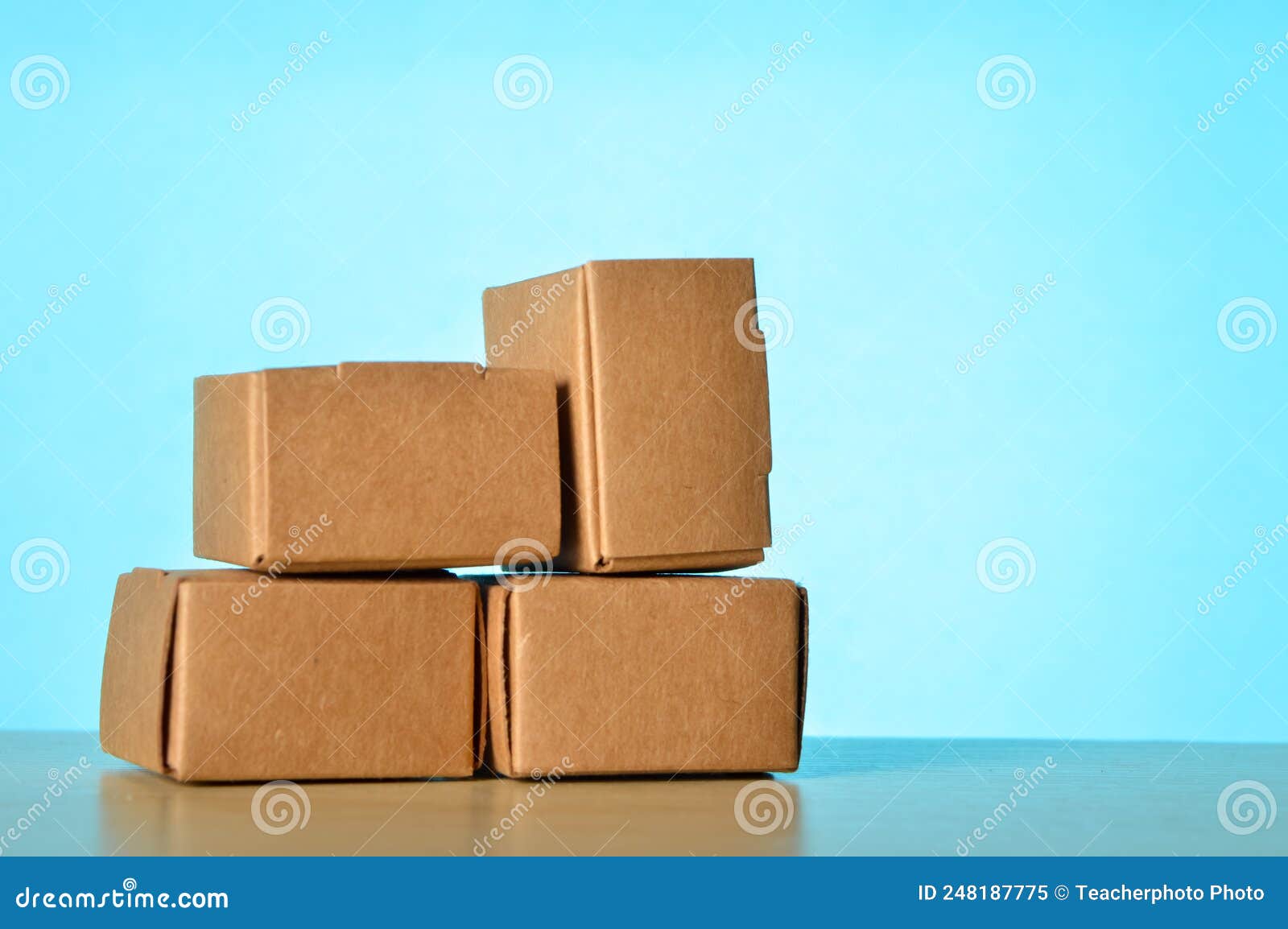 Stack of Cardboard Boxes Isolated on a Blue Background. Stock Market ...