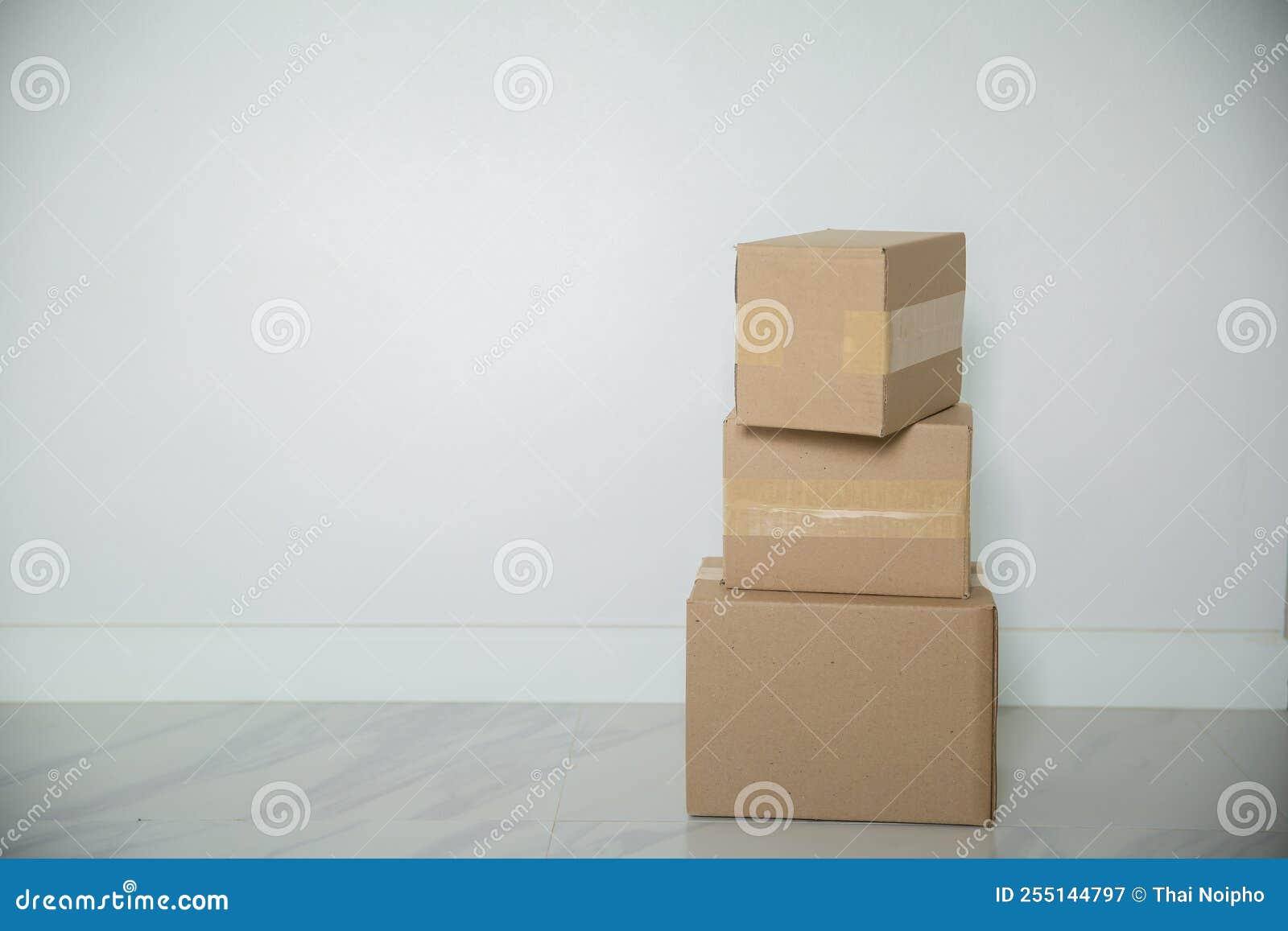 Stack of Cardboard Boxes for Moving, Empty Room with a White Wall and ...