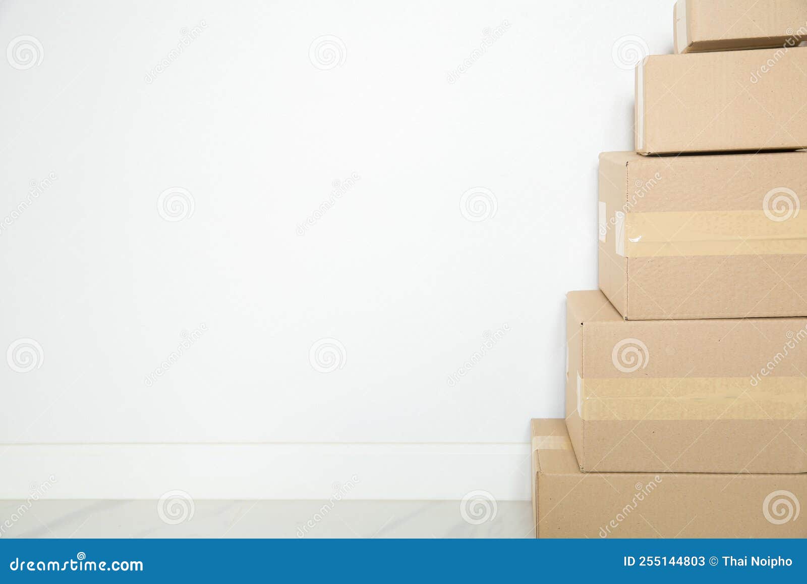 Stack of Cardboard Boxes for Moving, Empty Room with a White Wall and ...