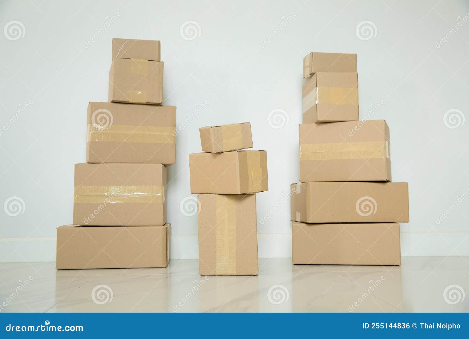 Stack of Cardboard Boxes for Moving, Empty Room with a White Wall and ...