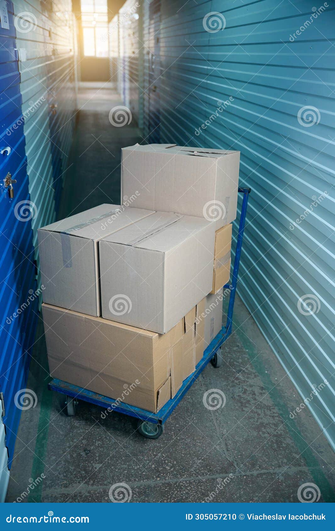 Stack of Cardboard Moving Boxes in the Hallway Stock Photo - Image of ...