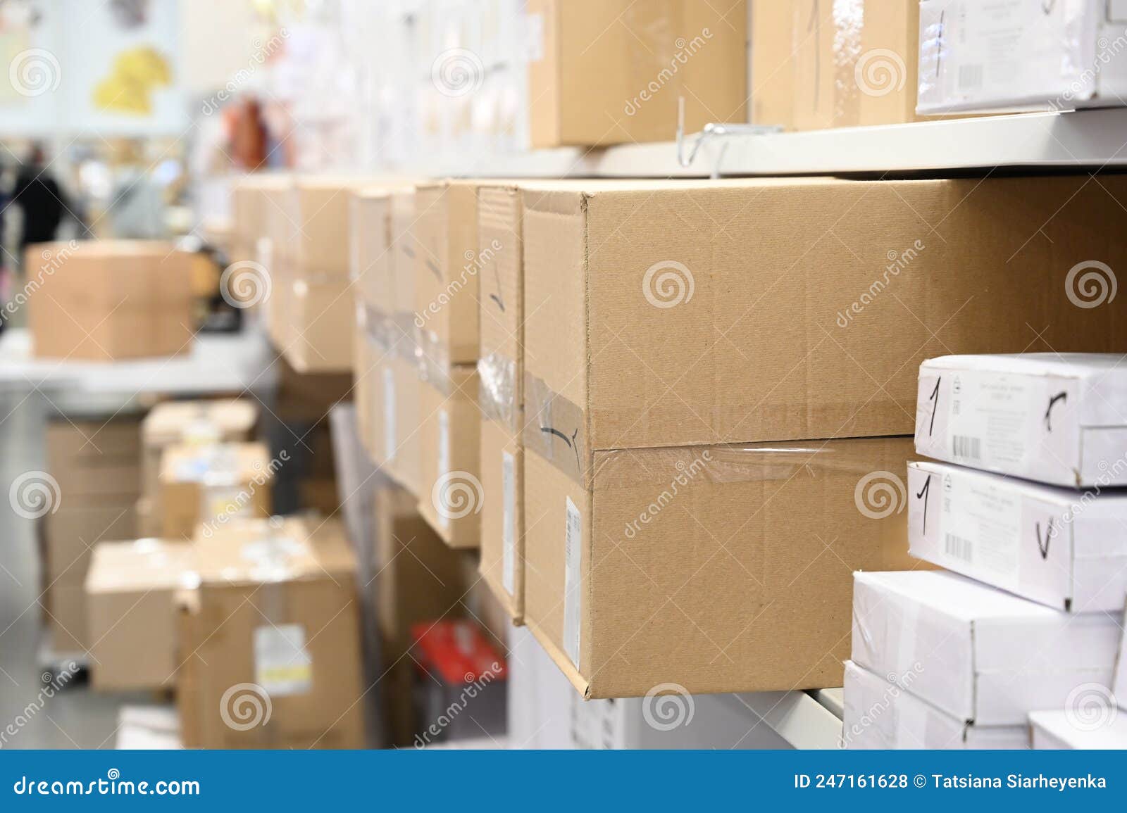 Stack of Carton Boxes at Logistics Warehouse. Rows of Shelves with ...