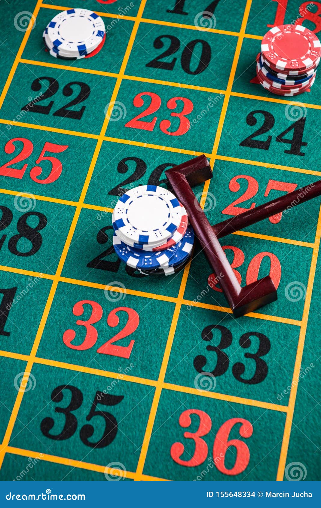Stack of Casino Chips on Green Felt Roulette Table with Lucky Numbers ...