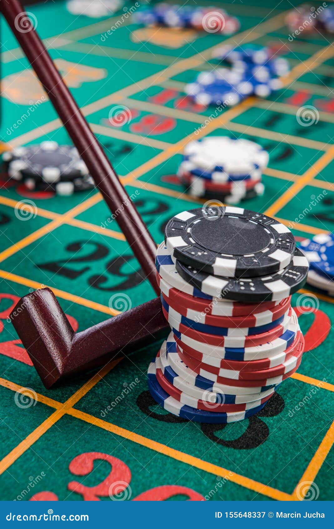 Stack of Casino Chips on Green Felt Roulette Table with Lucky Numbers ...