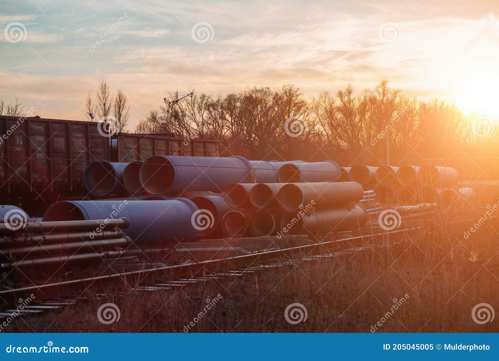 Stack of Cast Iron Pipes in Loading Area Waiting for Transportation ...