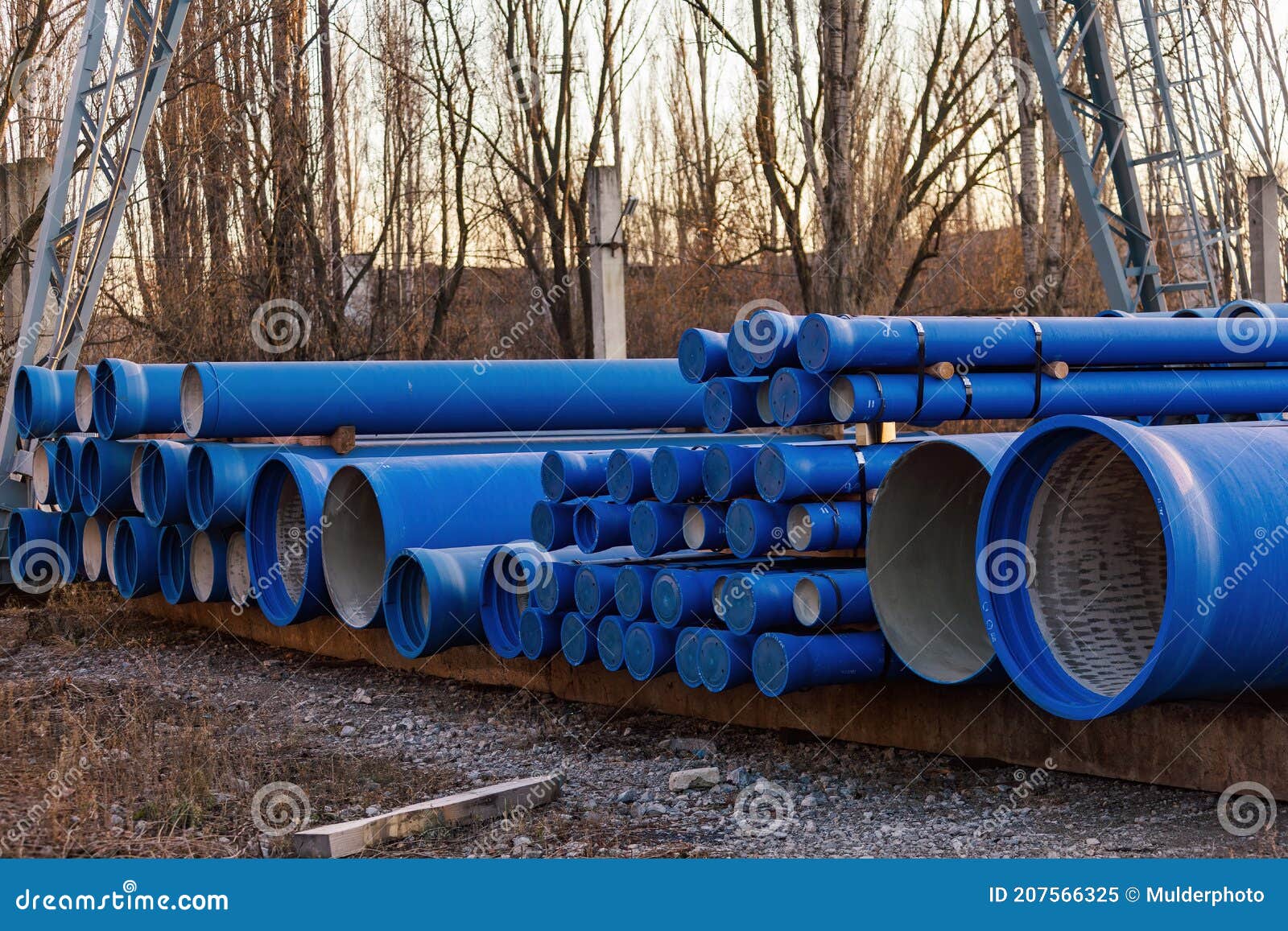 Stack of Cast Iron Pipes in Loading Area Waiting for Transportation ...