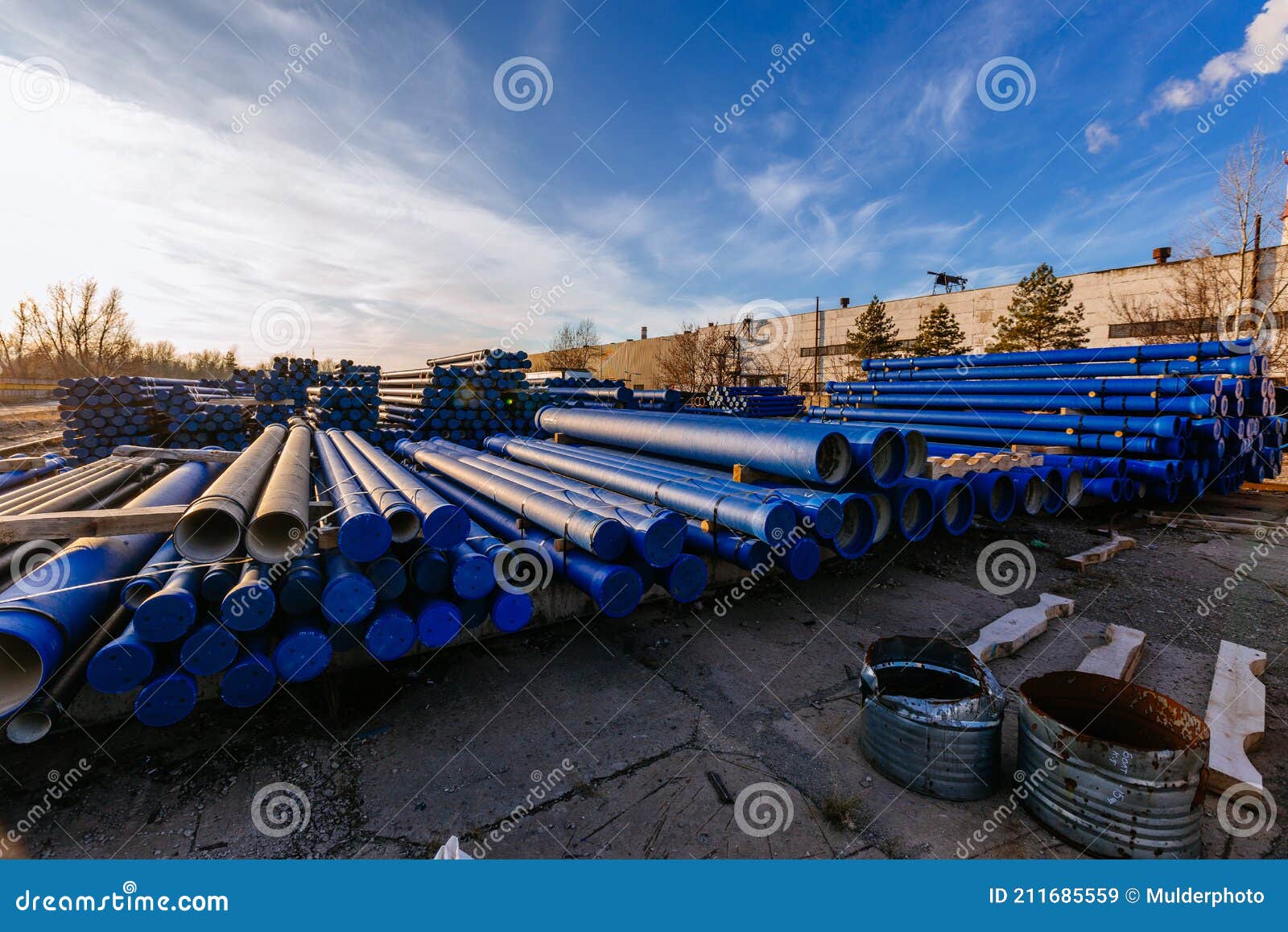 Stack of Cast Iron Pipes in Loading Area Waiting for Transportation ...