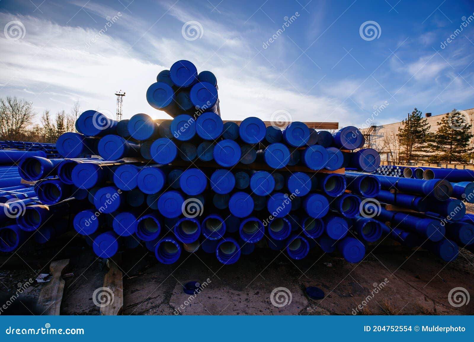 Stack of Cast Iron Pipes in Loading Area Waiting for Transportation ...