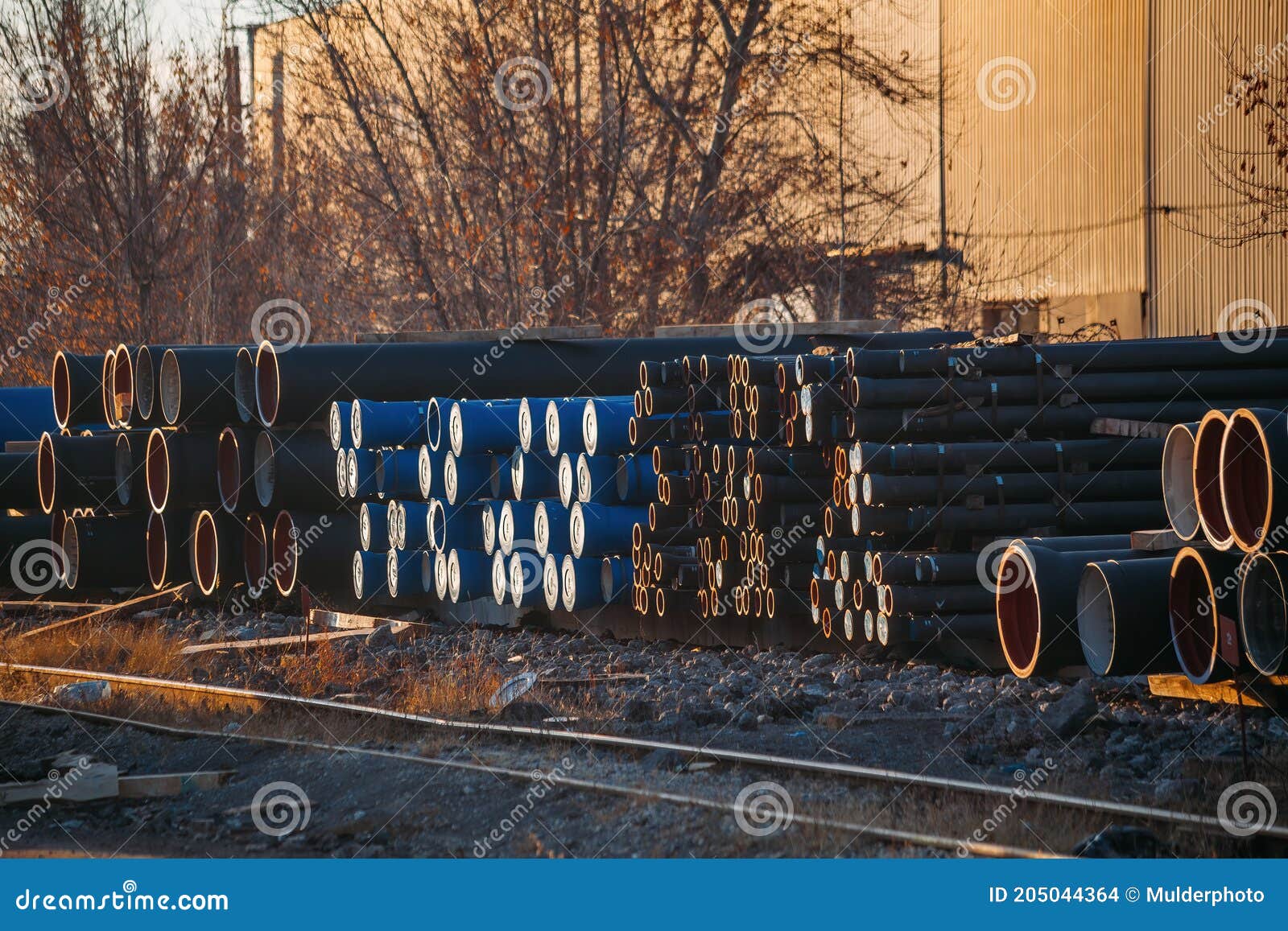 Stack Of Cast Iron Pipes In Loading Area Waiting For Transportation ...