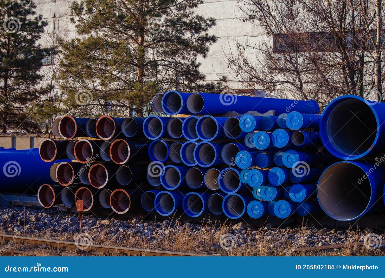 Stack Of Cast Iron Pipes In Loading Area Waiting For Transportation ...