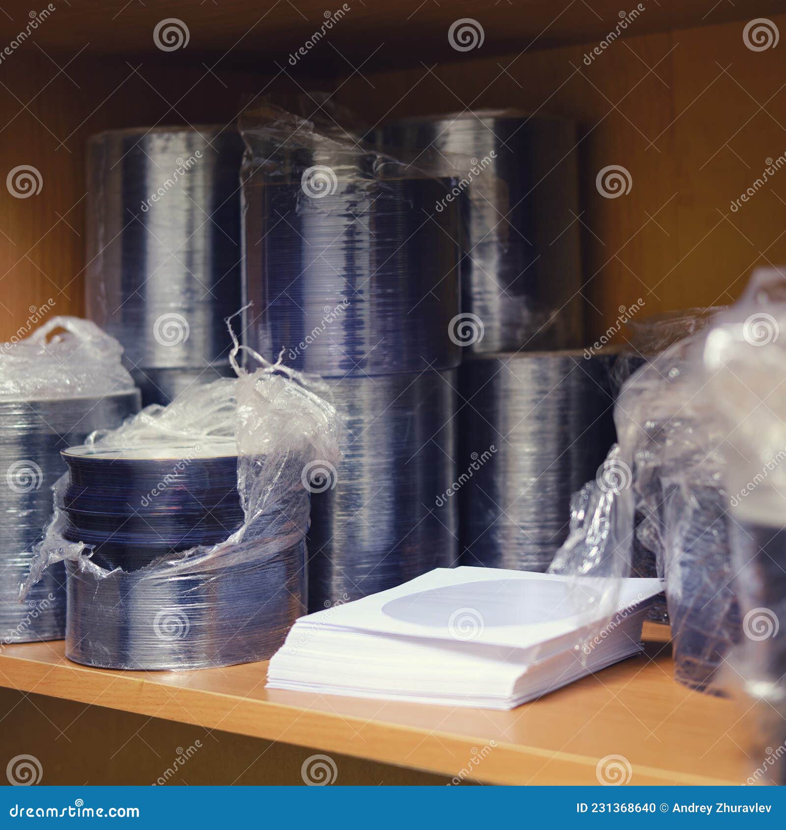 A Stack of CD and DVD Discs in a Package on the Shelf Stock Photo ...