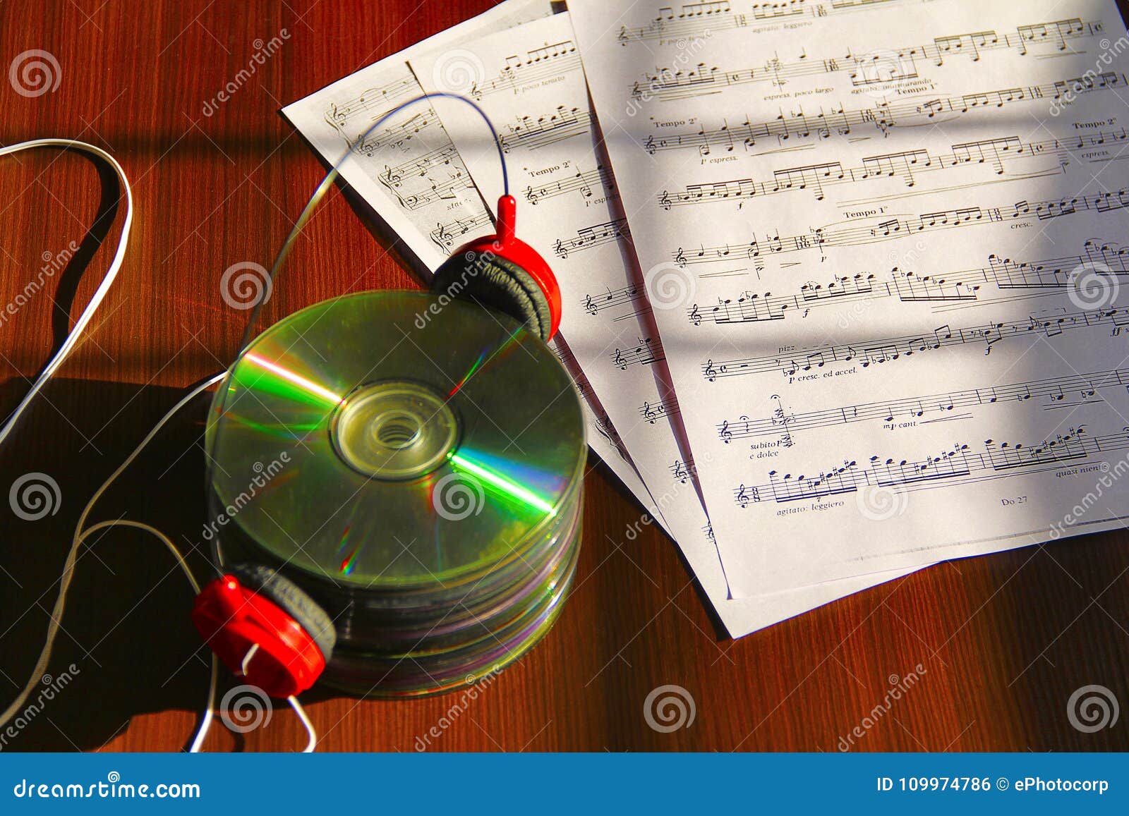 Stack of CDs with Headphone and Musical Notes Stock Photo - Image of ...