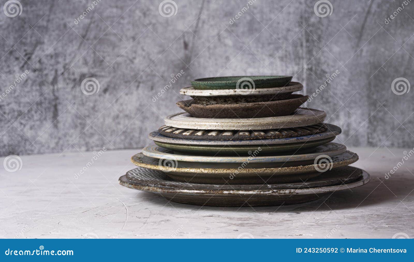 A stack of ceramic plates stock photo. Image of manufacture - 243250592