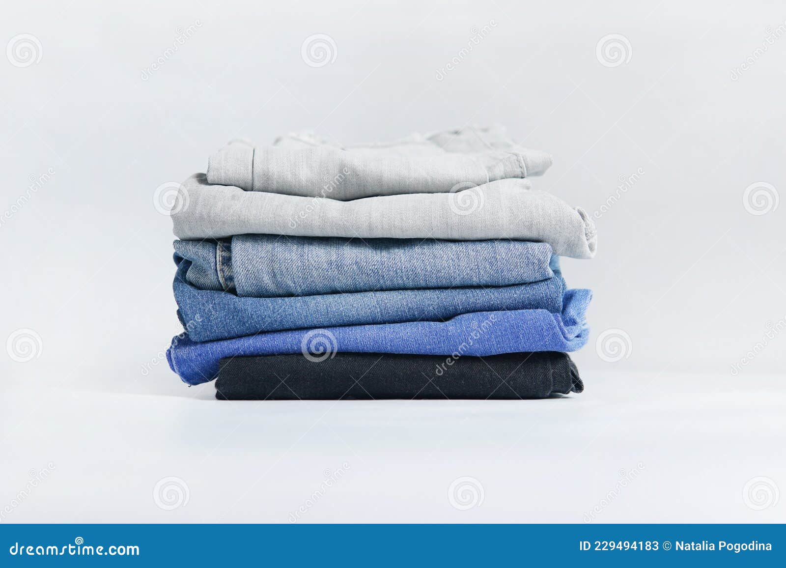A Stack of Children S Clothes. Jeans. Stock Image - Image of clothes ...