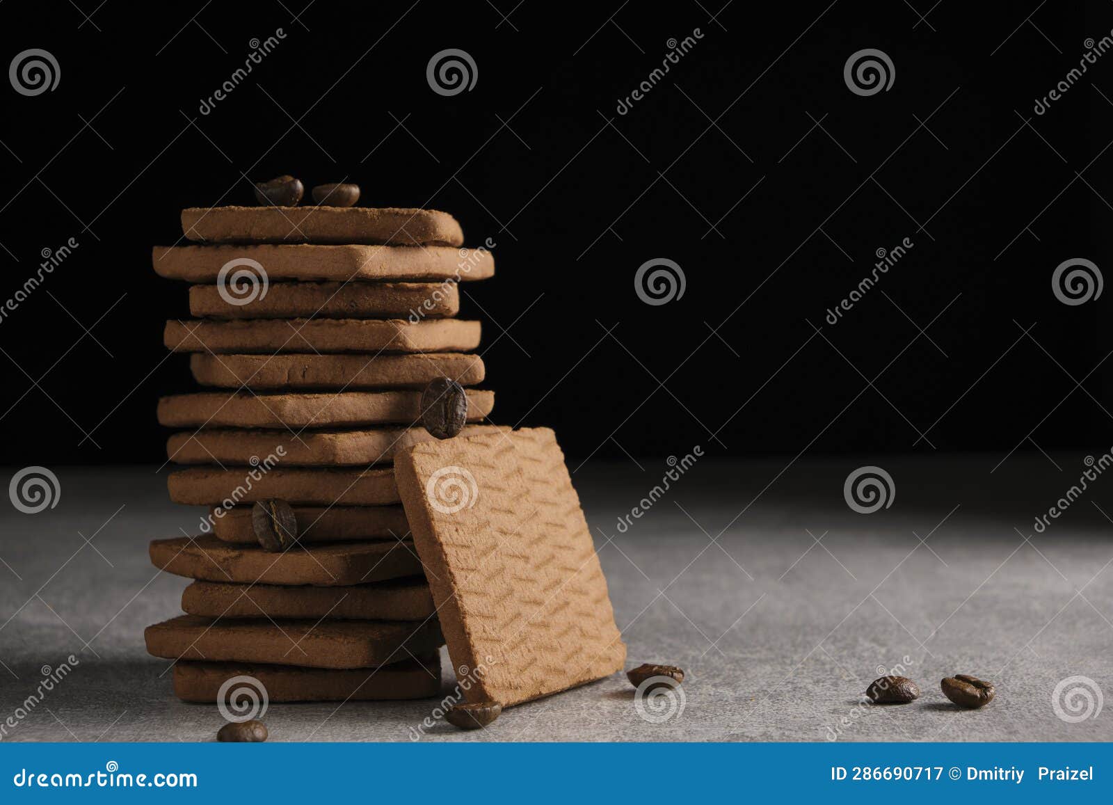 Stack of Chocolate Cookies and Scattered Coffee Beans on Black ...