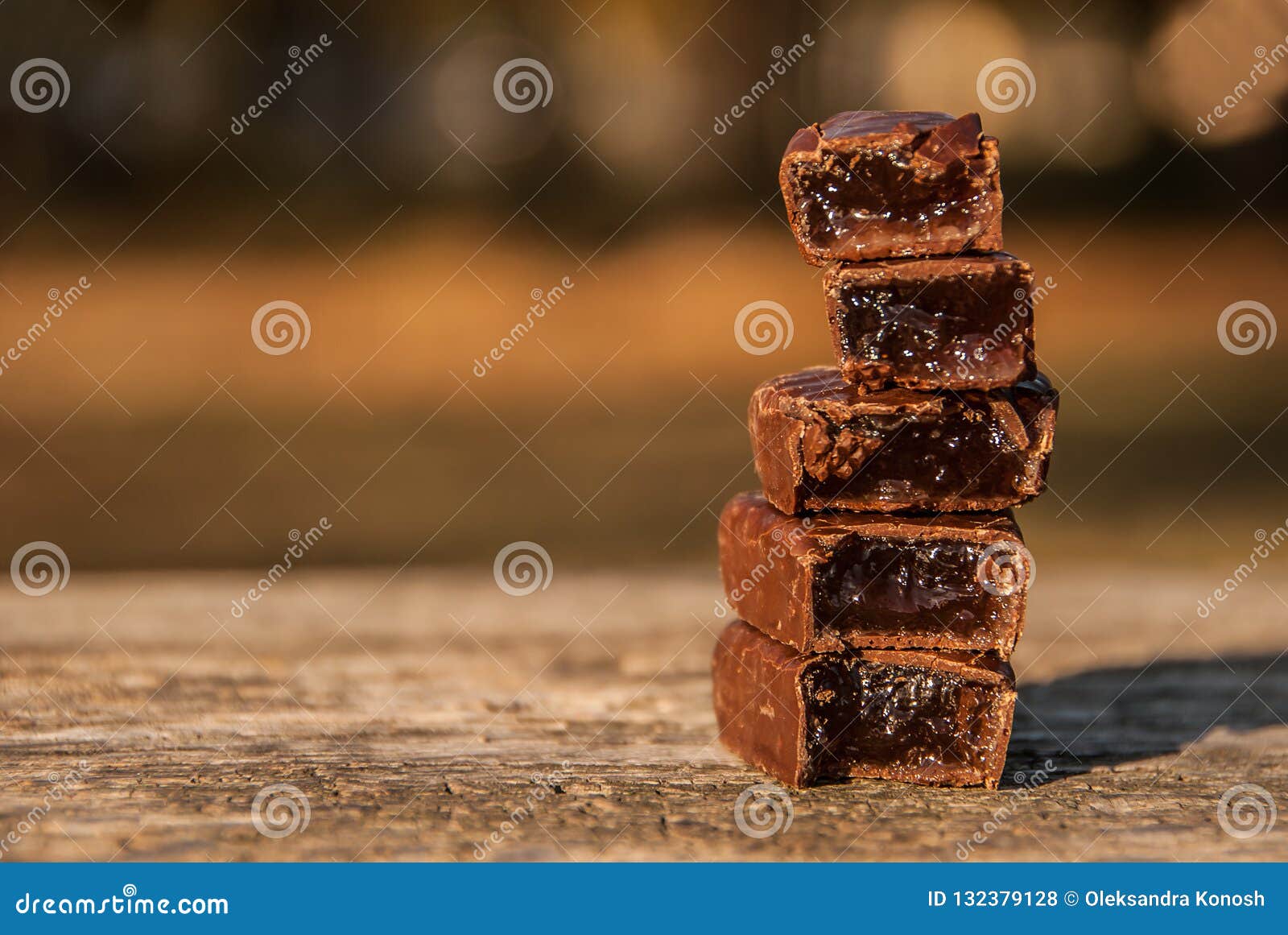 Stack of Chocolates on Wooden Background in Park, Background. Stock ...