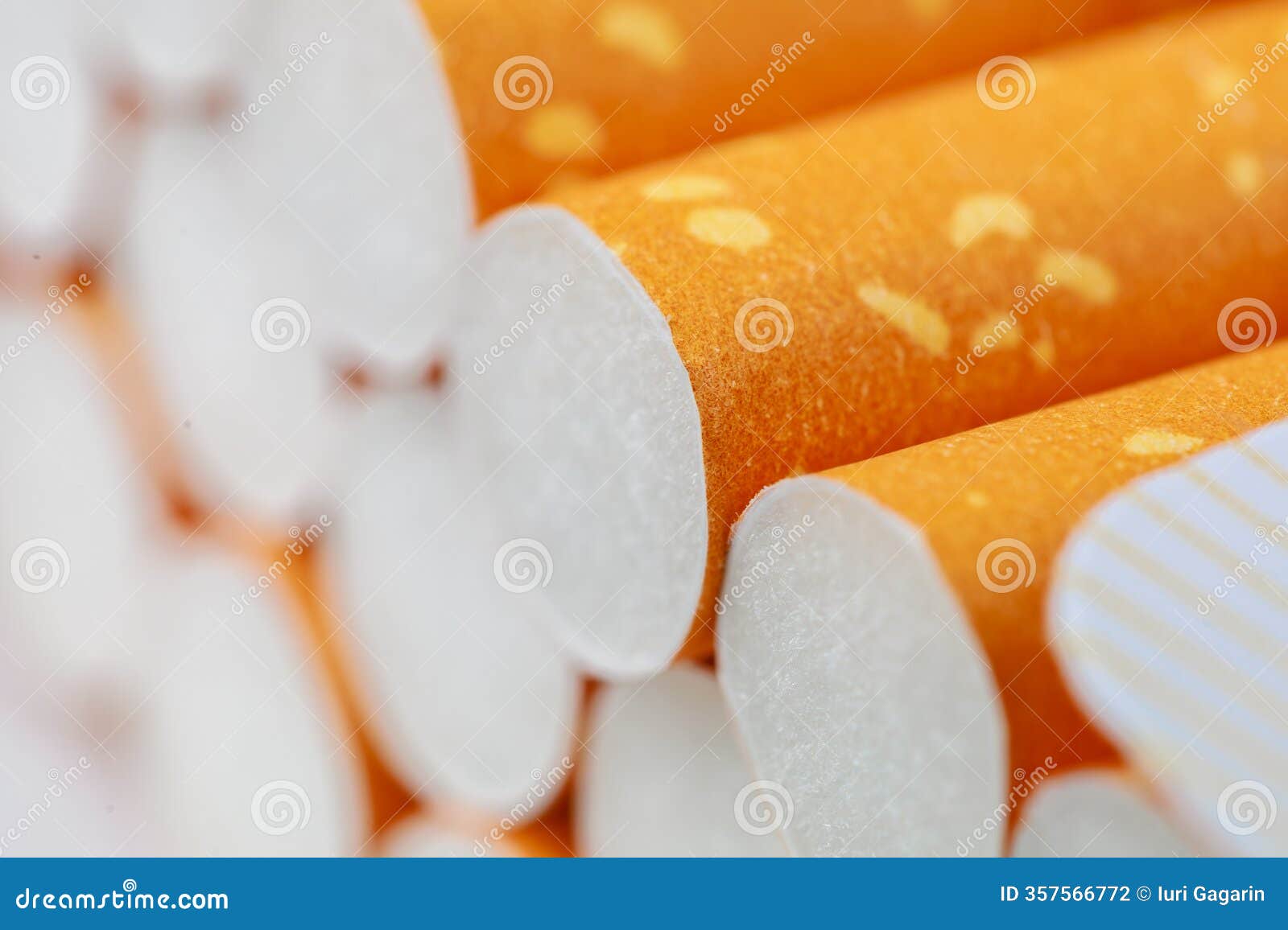 A Stack of Cigarettes with a Yellow Wrapper Stock Photo - Image of ...