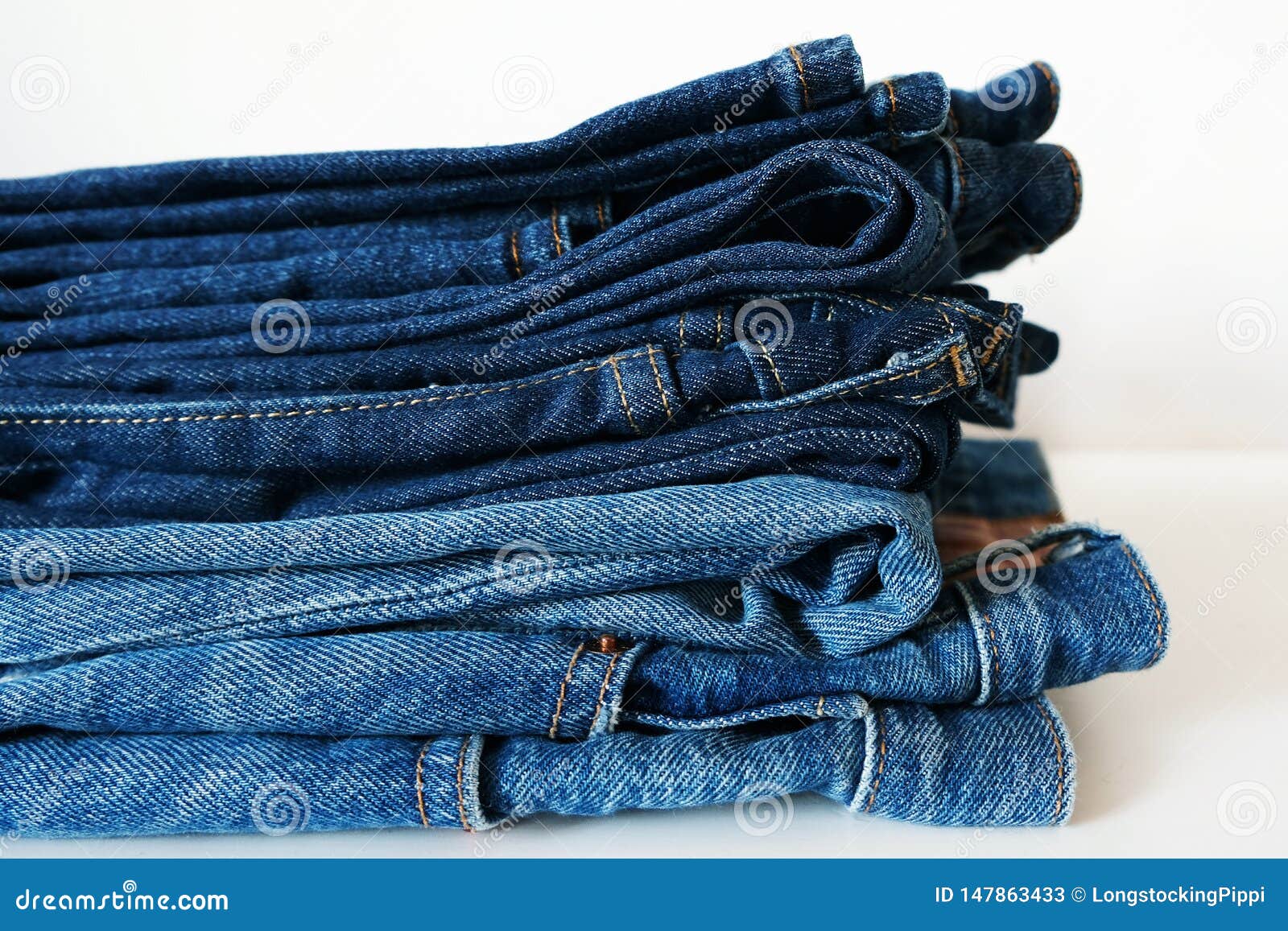 Stack of blue jeans stock image. Image of dark, stylish - 147863433