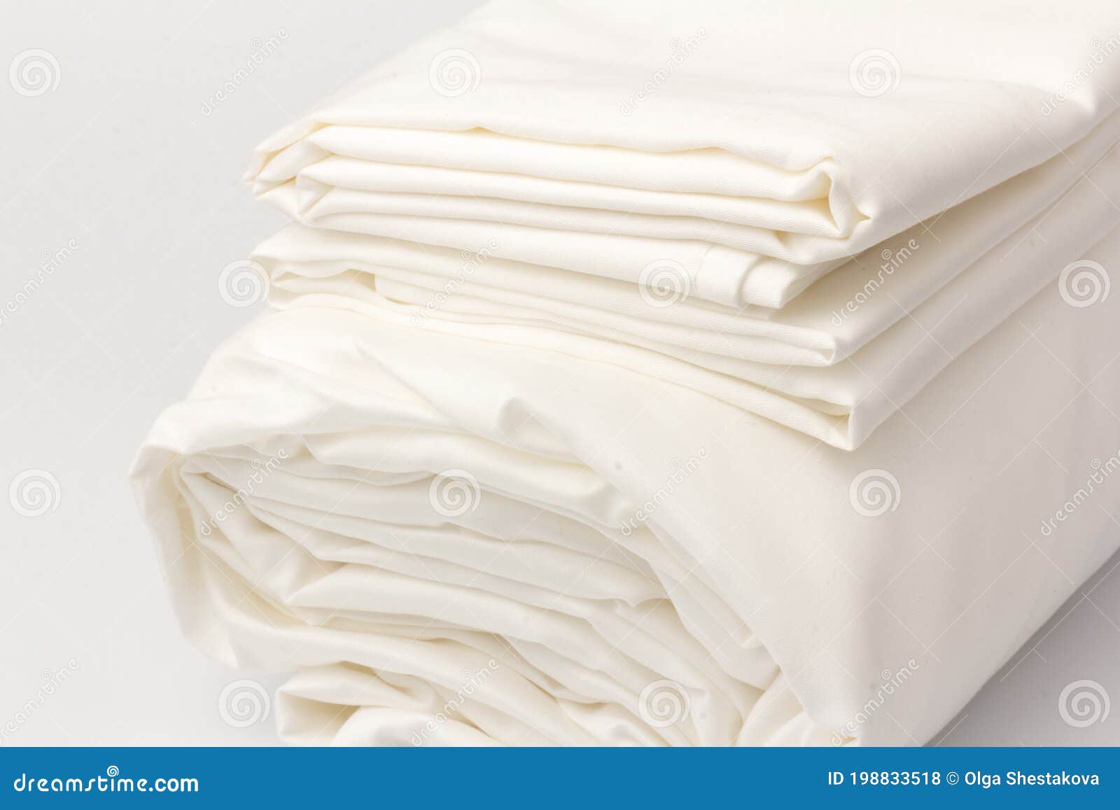 Stack of Clean Bed Sheets on White Background, Closeup Stock Photo ...