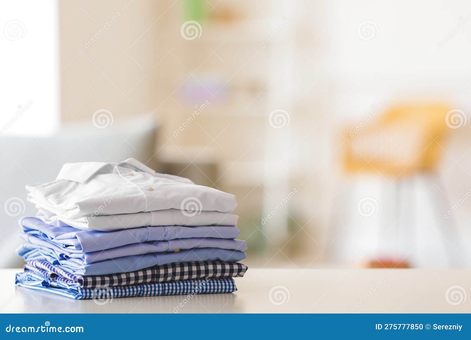Stack of Clean Clothes on Table in Room Stock Photo - Image of sanitary ...