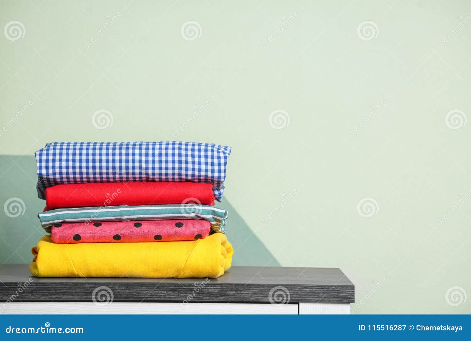 Stack of Clean Clothes on Table Stock Image - Image of background ...