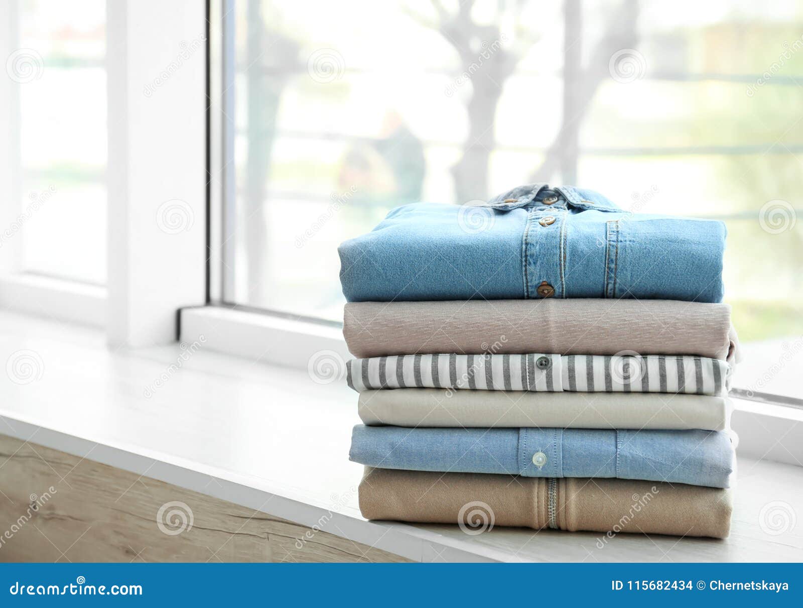 Stack of Clean Clothes on Sill Stock Photo - Image of folded, clothes ...