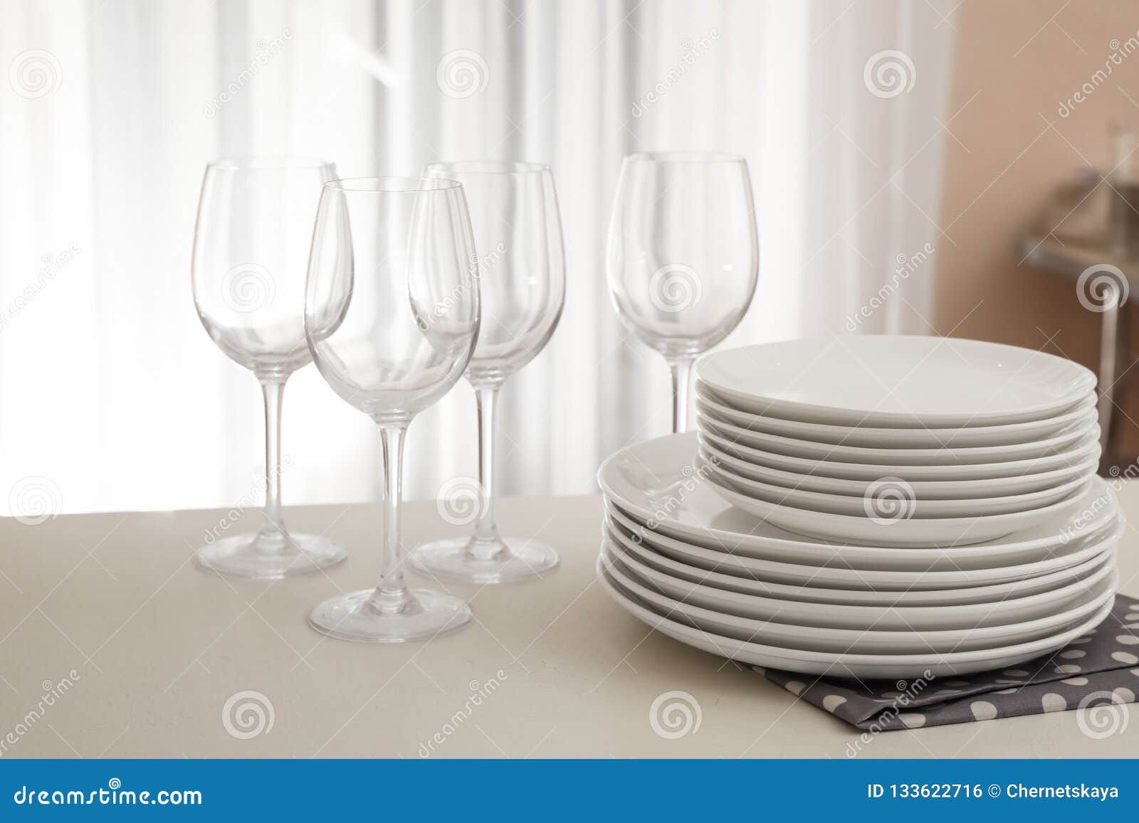 Stack of Clean Dishes and Glasses on Table Stock Photo - Image of ...