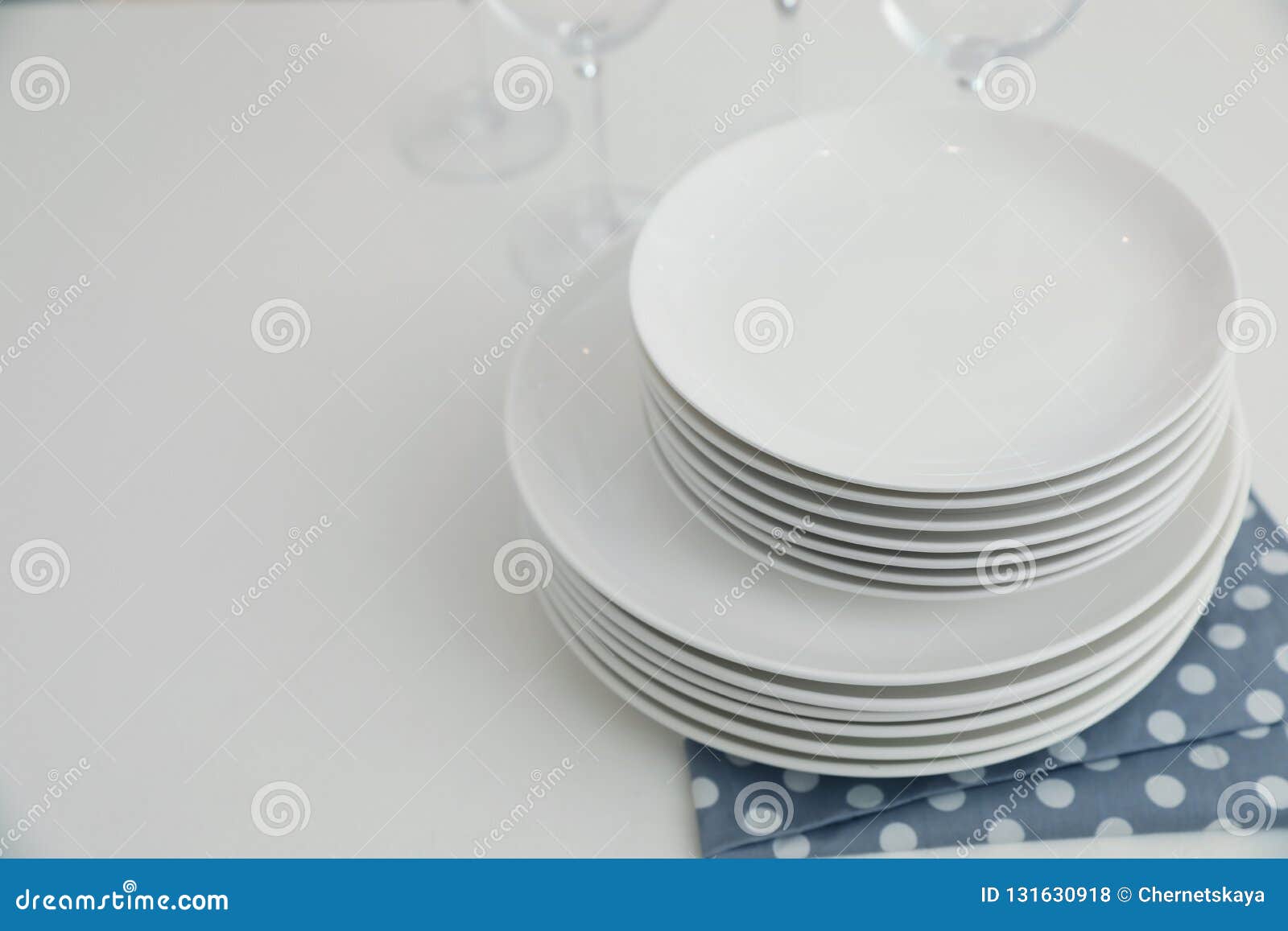 Stack of Clean Dishes on Table in Kitchen Stock Photo - Image of ...