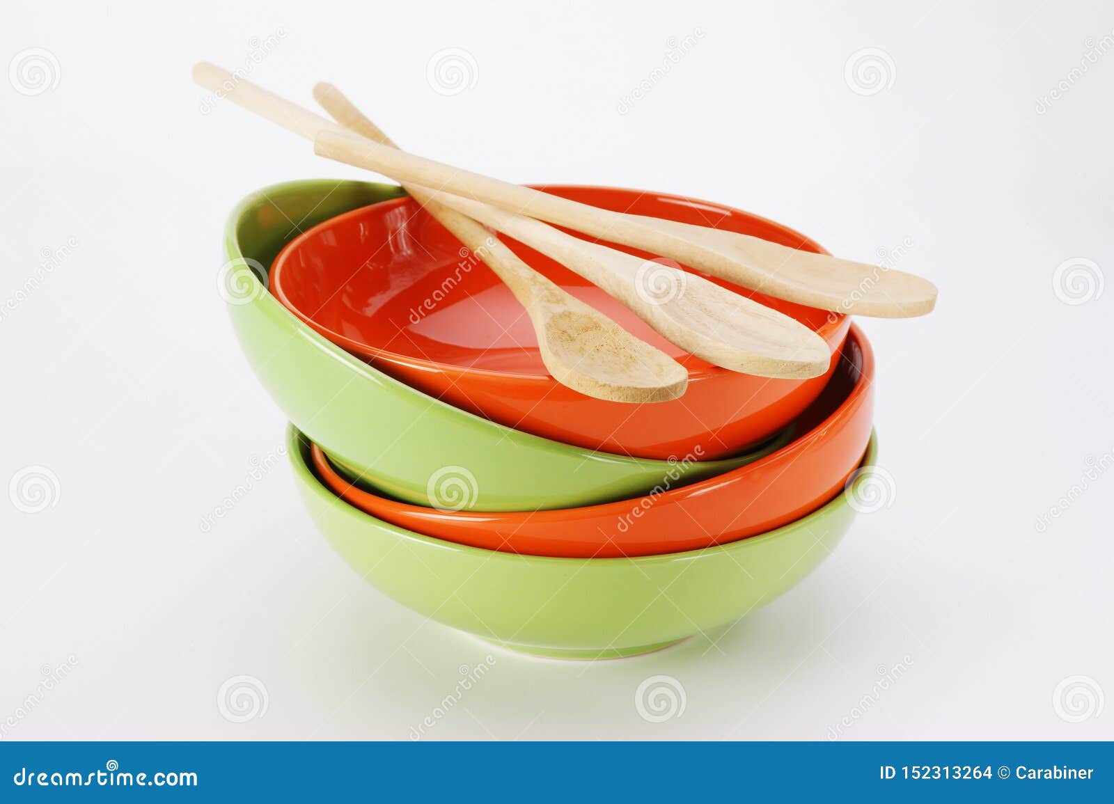 Stack of Clean Empty Plates and Wooden Spoons on White Stock Photo ...