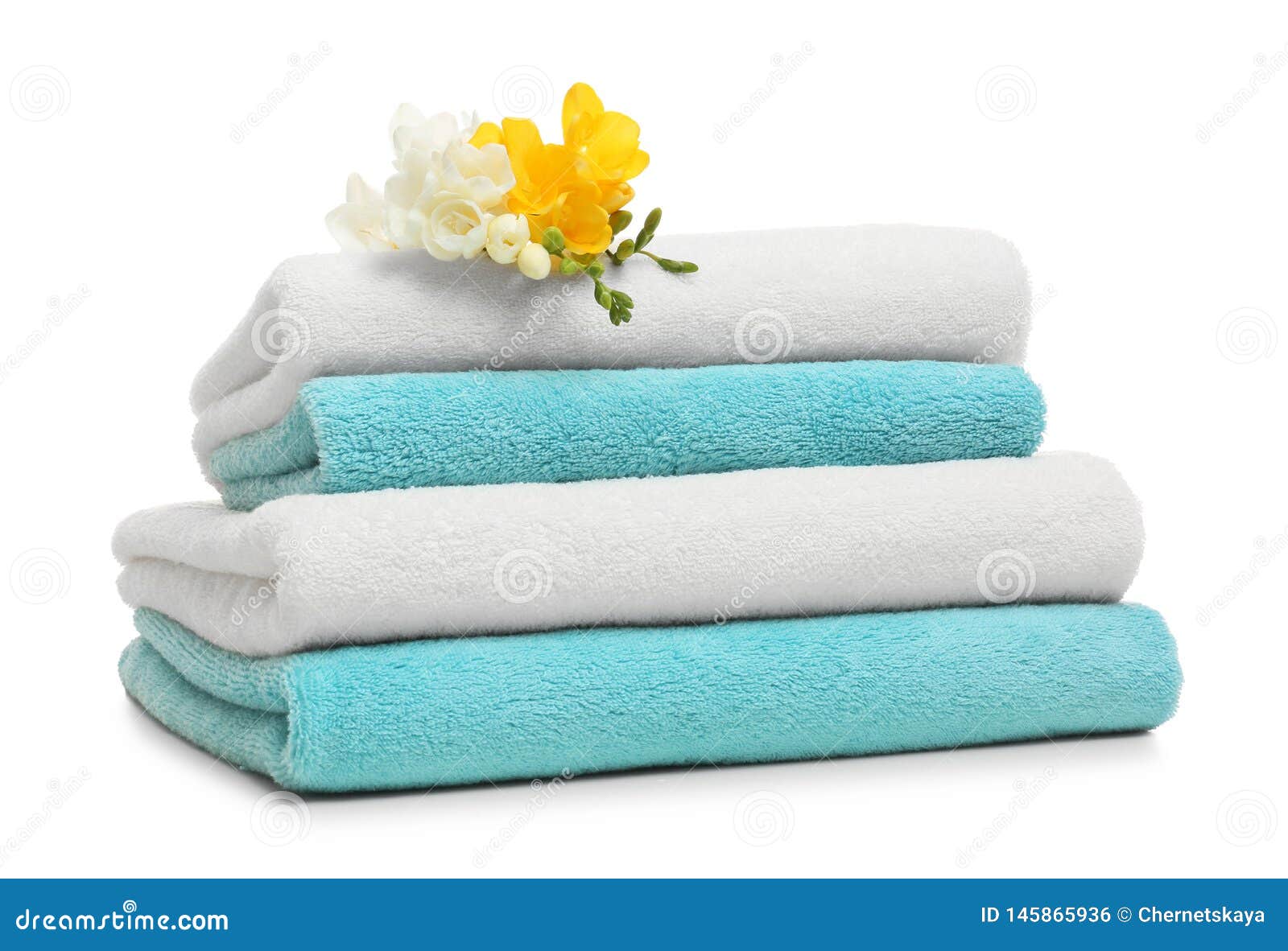 Stack of Clean Folded Towels with Flowers on White Stock Photo - Image ...