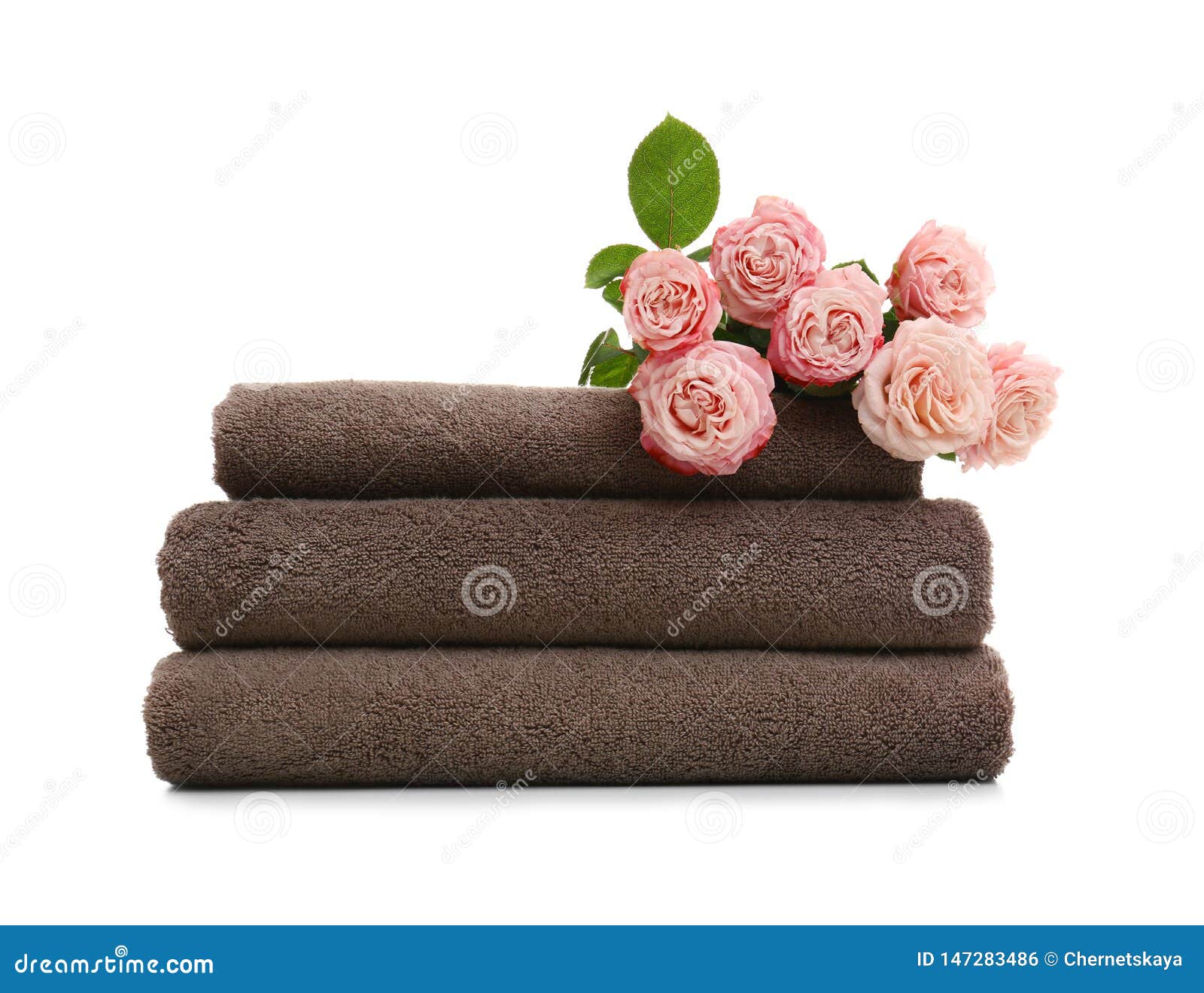 Stack of Clean Folded Towels with Flowers on White Stock Photo - Image ...