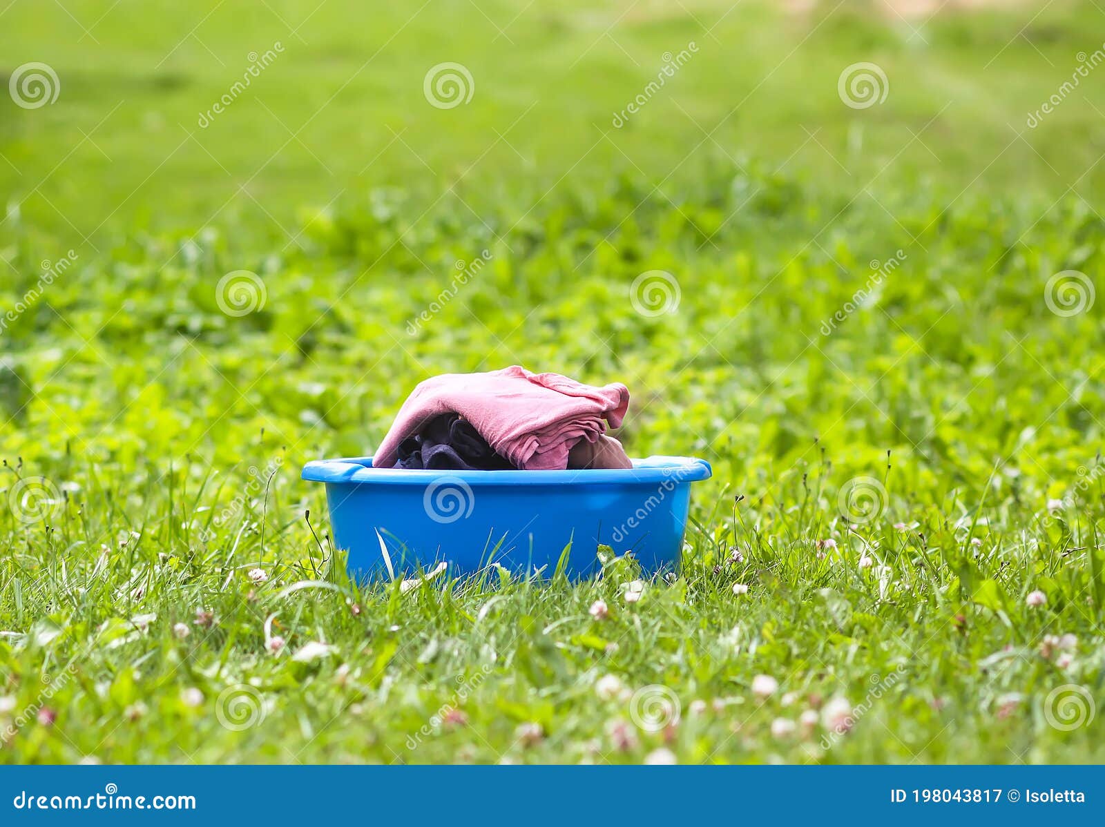 Stack of Clean Laundry in Plastic Cup Outdoors Stock Image - Image of ...