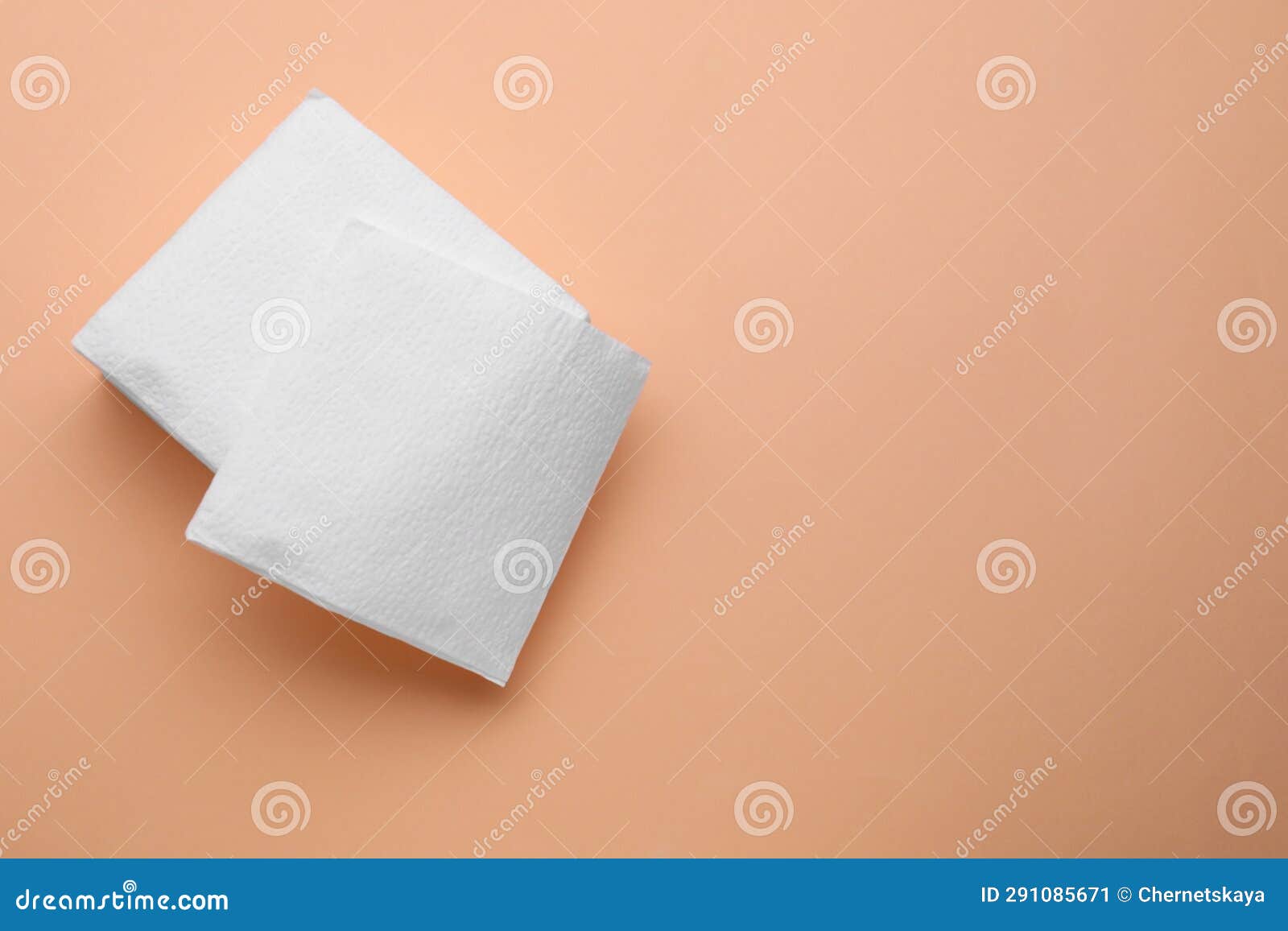 Stack of Clean Paper Tissues on Beige Background, Top View. Space for ...