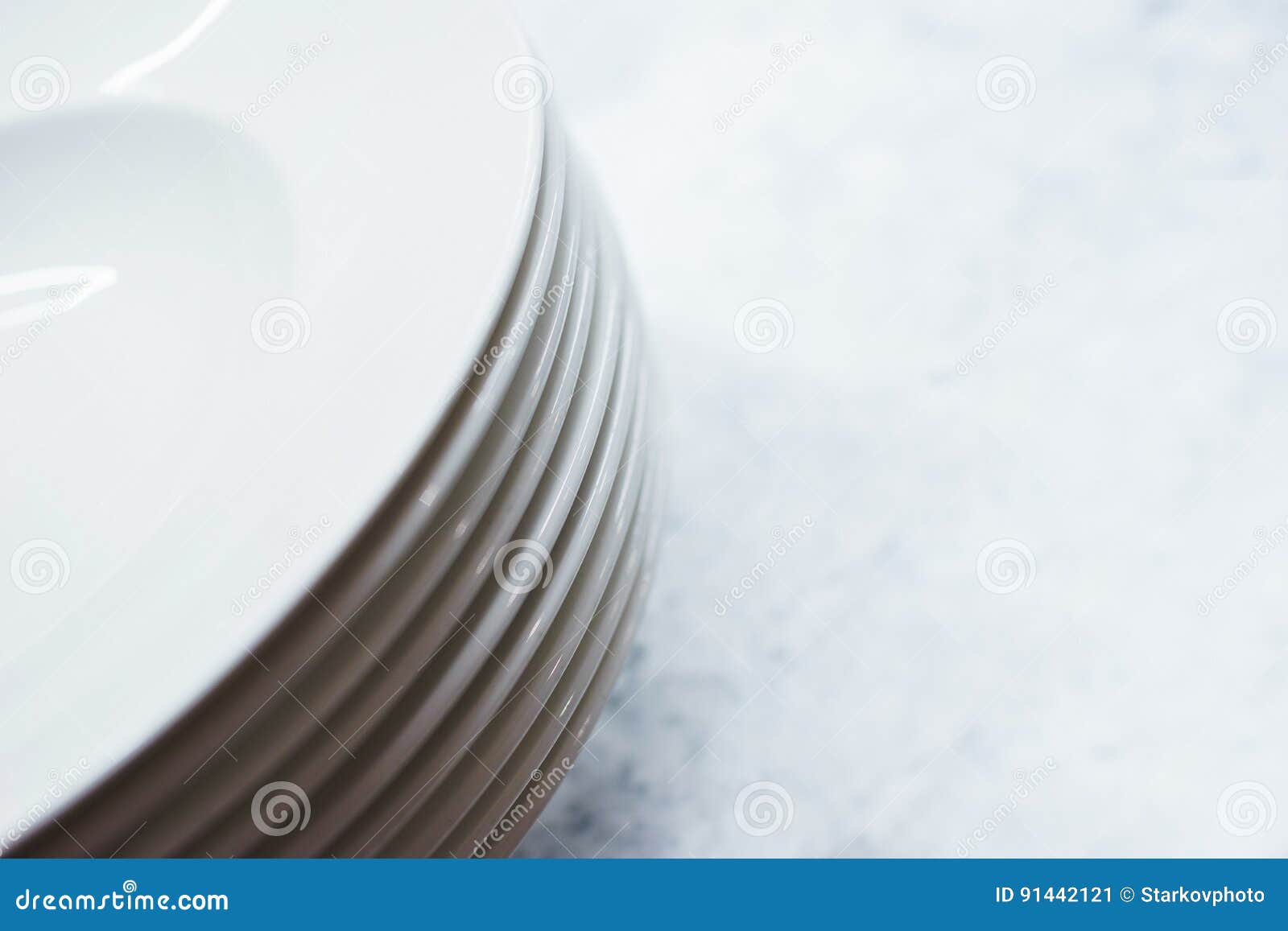 Stack of Clean Plates on the Table. Clean Prepared Dishes on a White ...