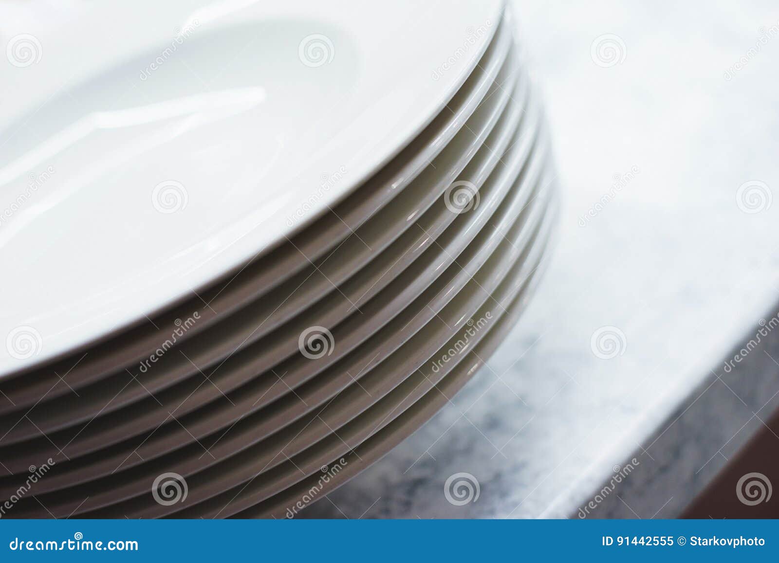 Stack of Clean Plates on the Table. Clean Prepared Dishes on a White ...